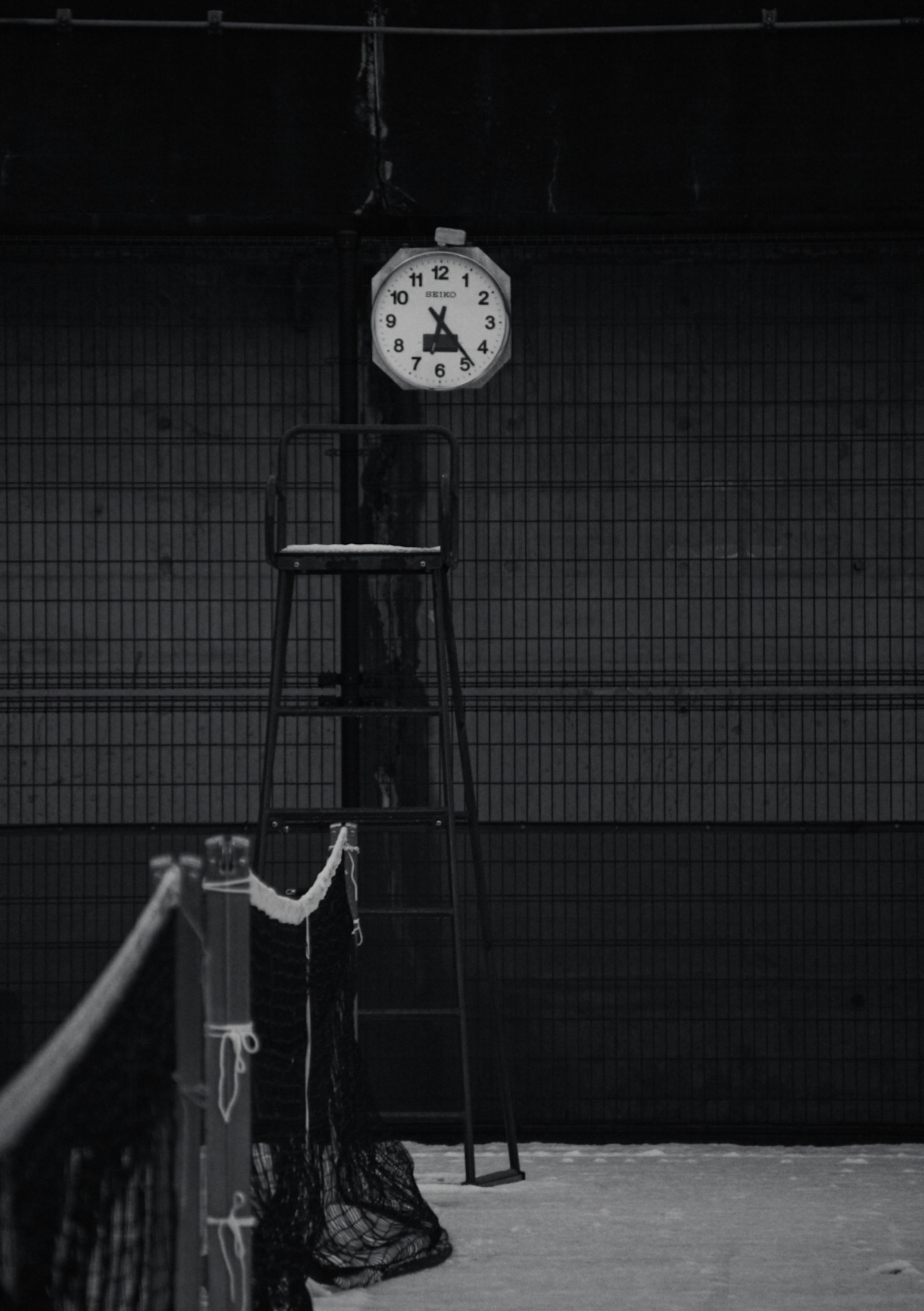 Timekeeper on a Steel Stage under Winter's Quiet