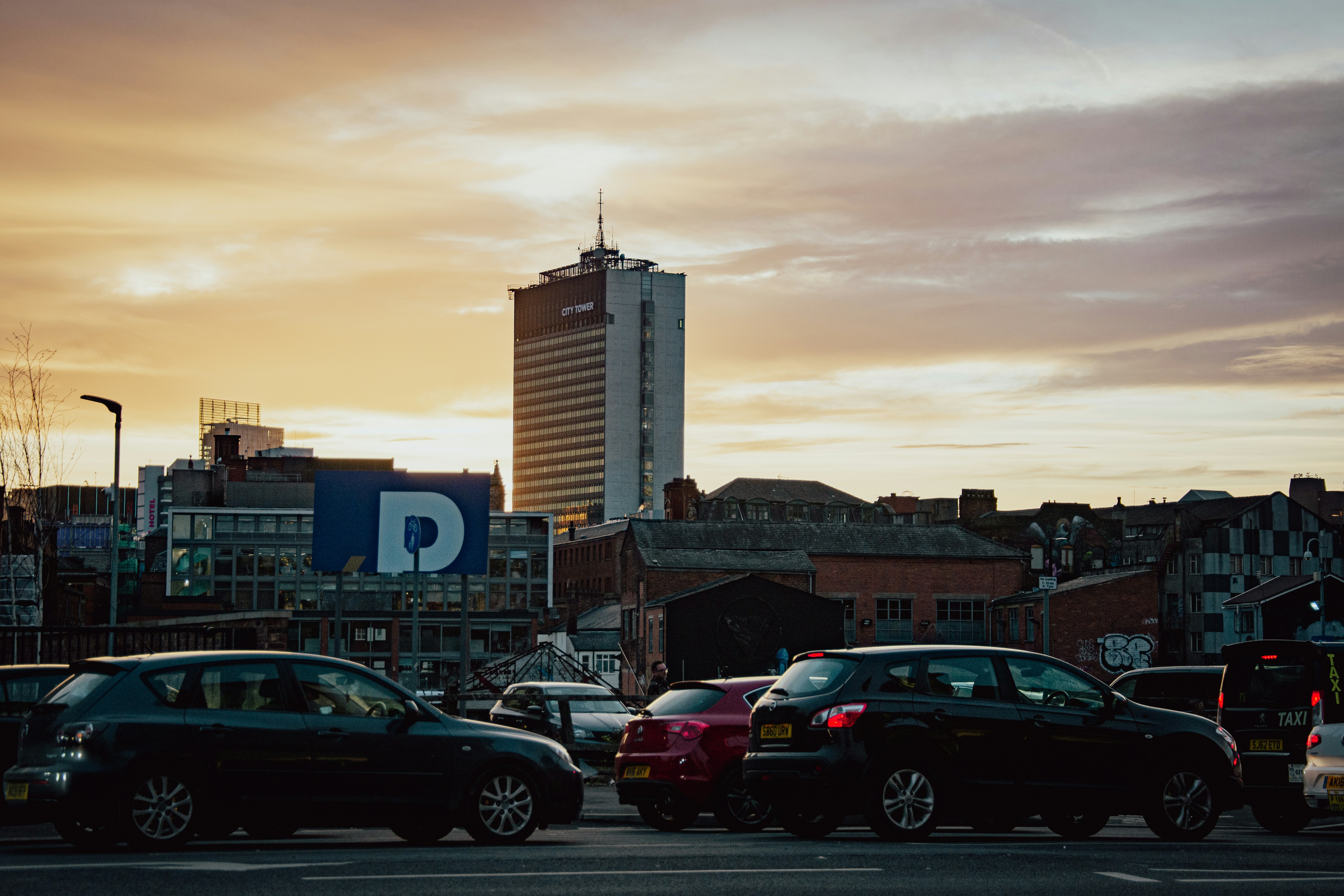 Evening Traffic Beneath a City Skyline