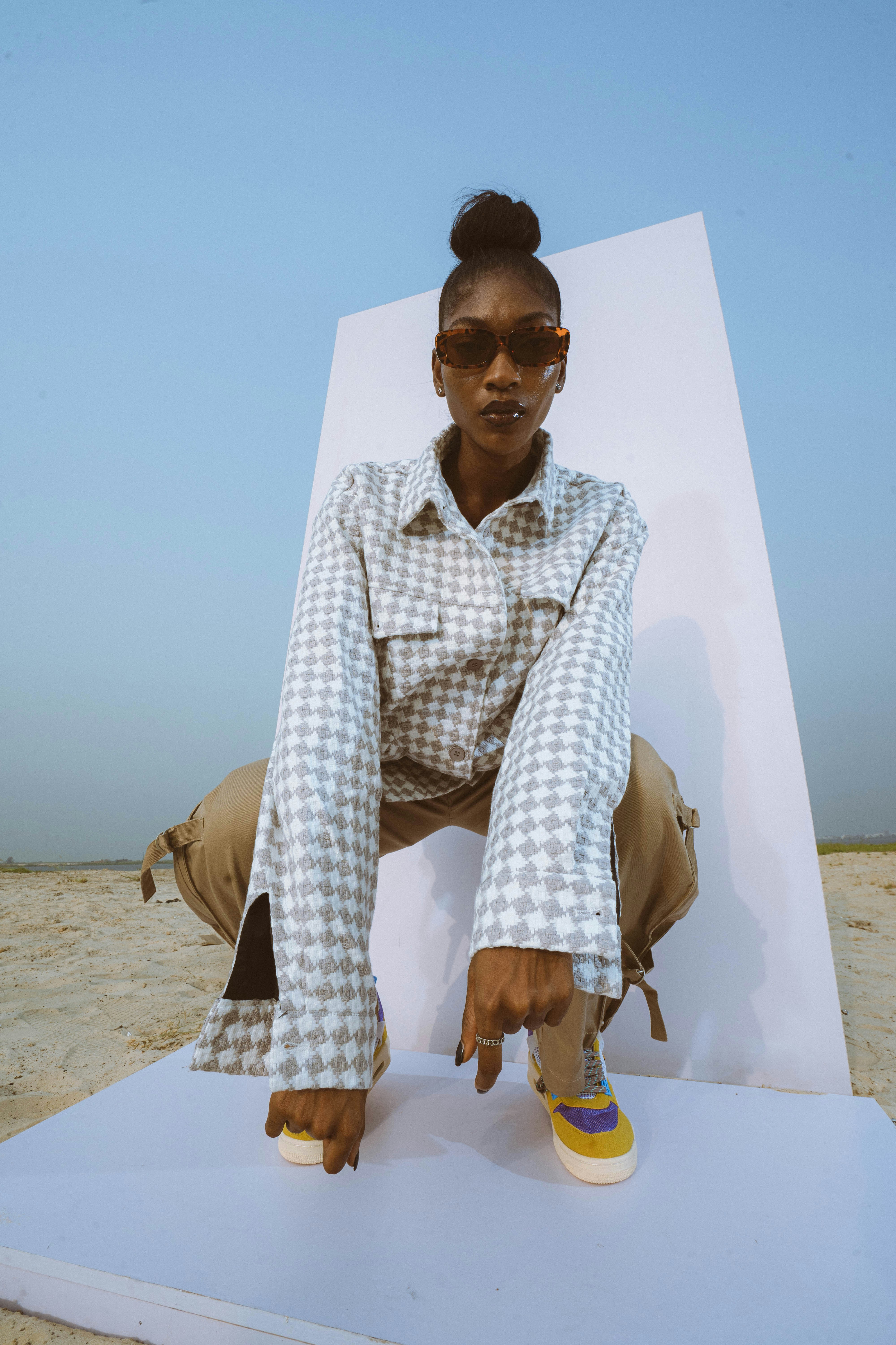 A woman sitting on top of a white object photo – Free New Image on Unsplash