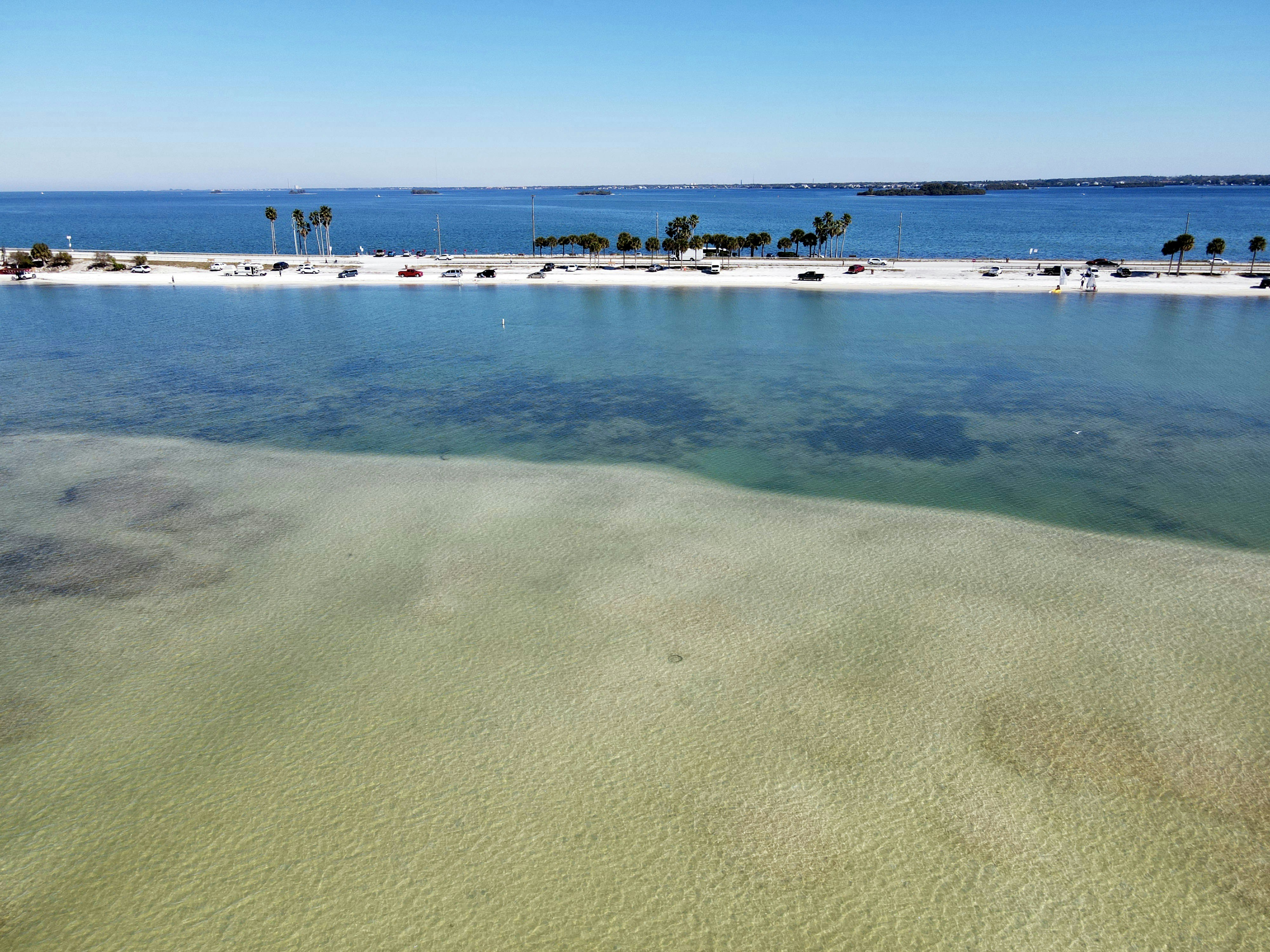 Palm-Line Barrier Beach: Aerial View Over a Turquoise Lagoon