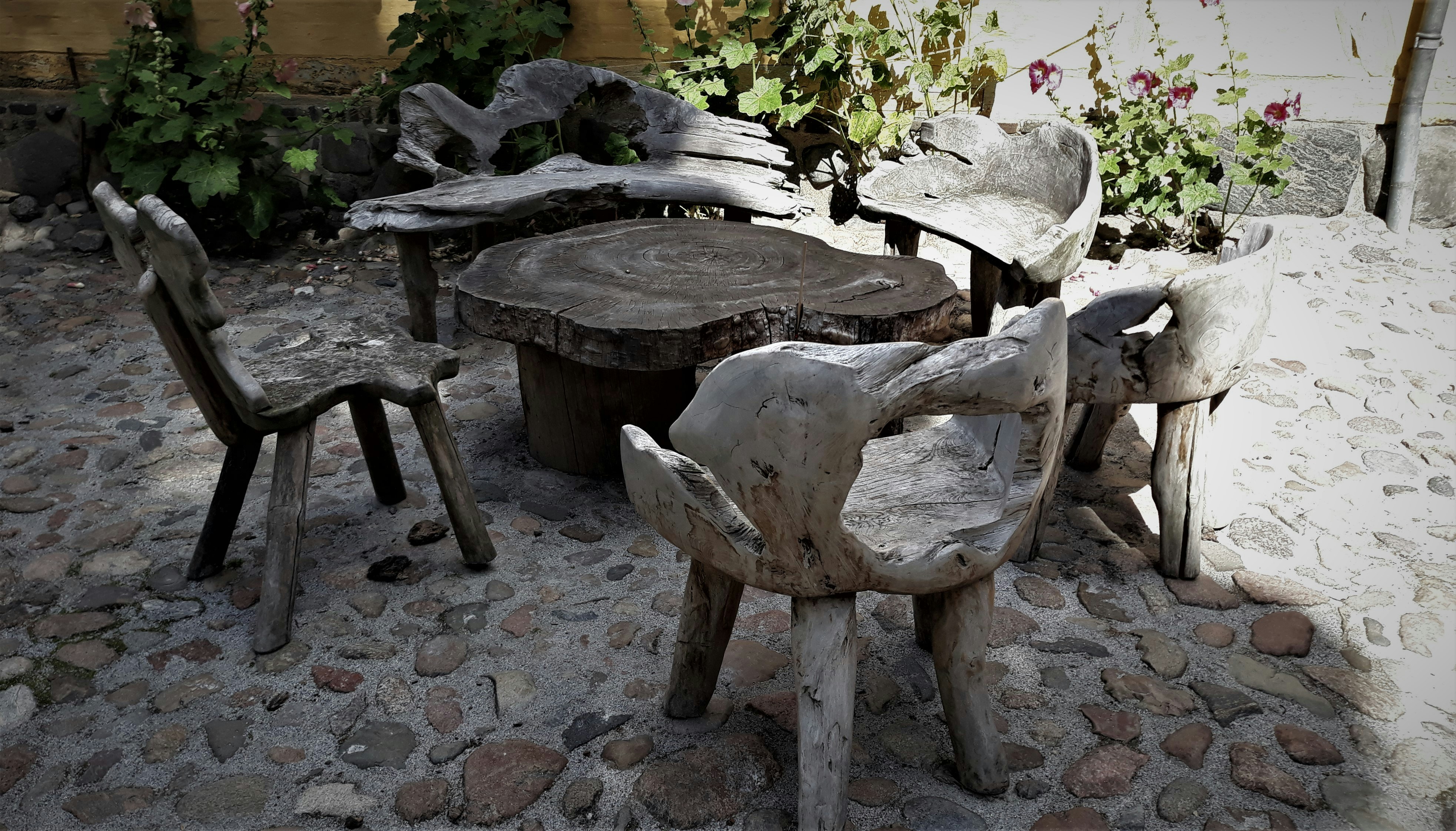 A table and chairs made out of tree stumps photo – Free Wood Image on ...