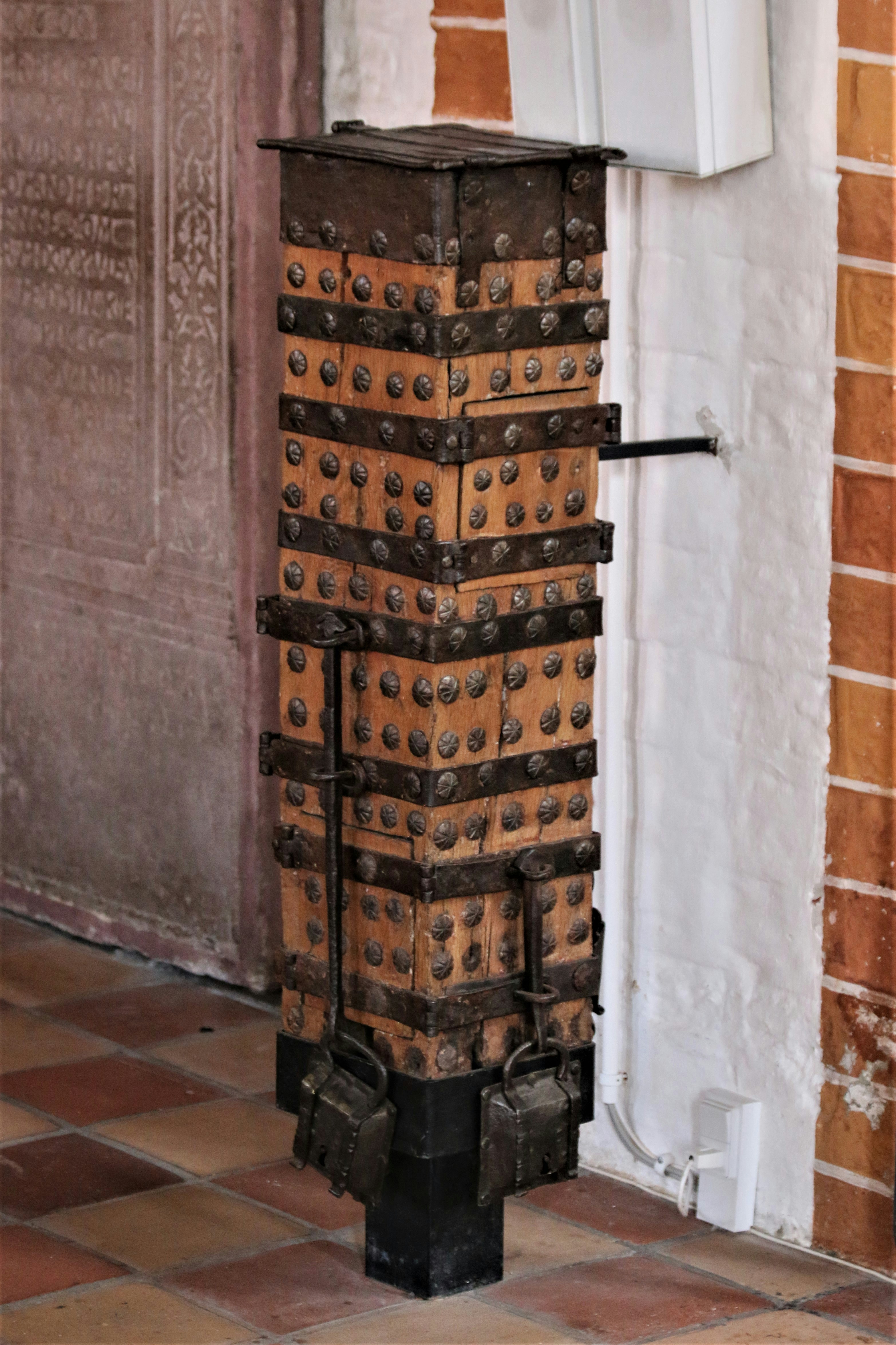 Intricately designed wooden storage chest with metal accents, showcasing craftsmanship from a bygone era.