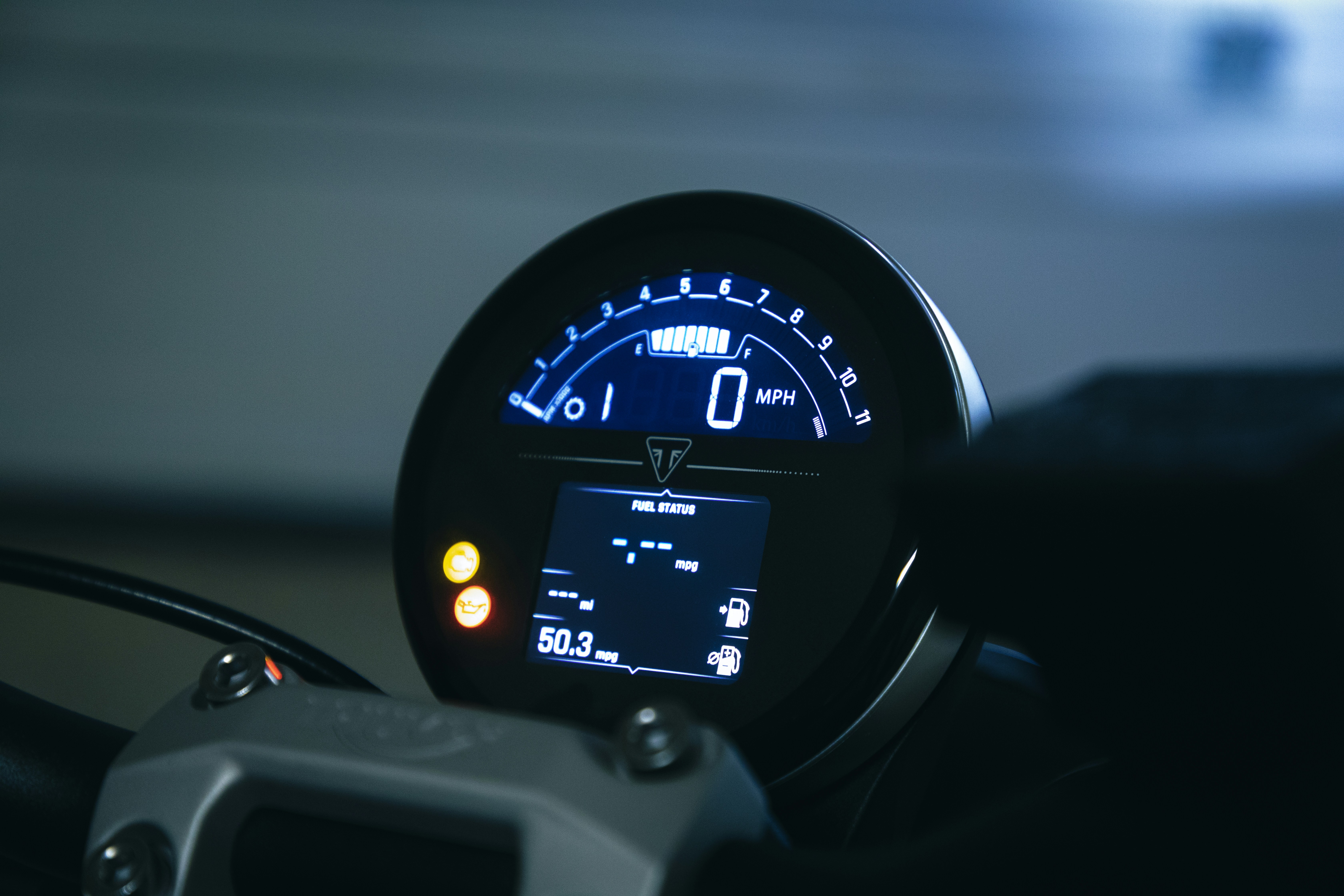 Neon Pulse on a Motorcycle Dashboard: Night Readouts in Focus