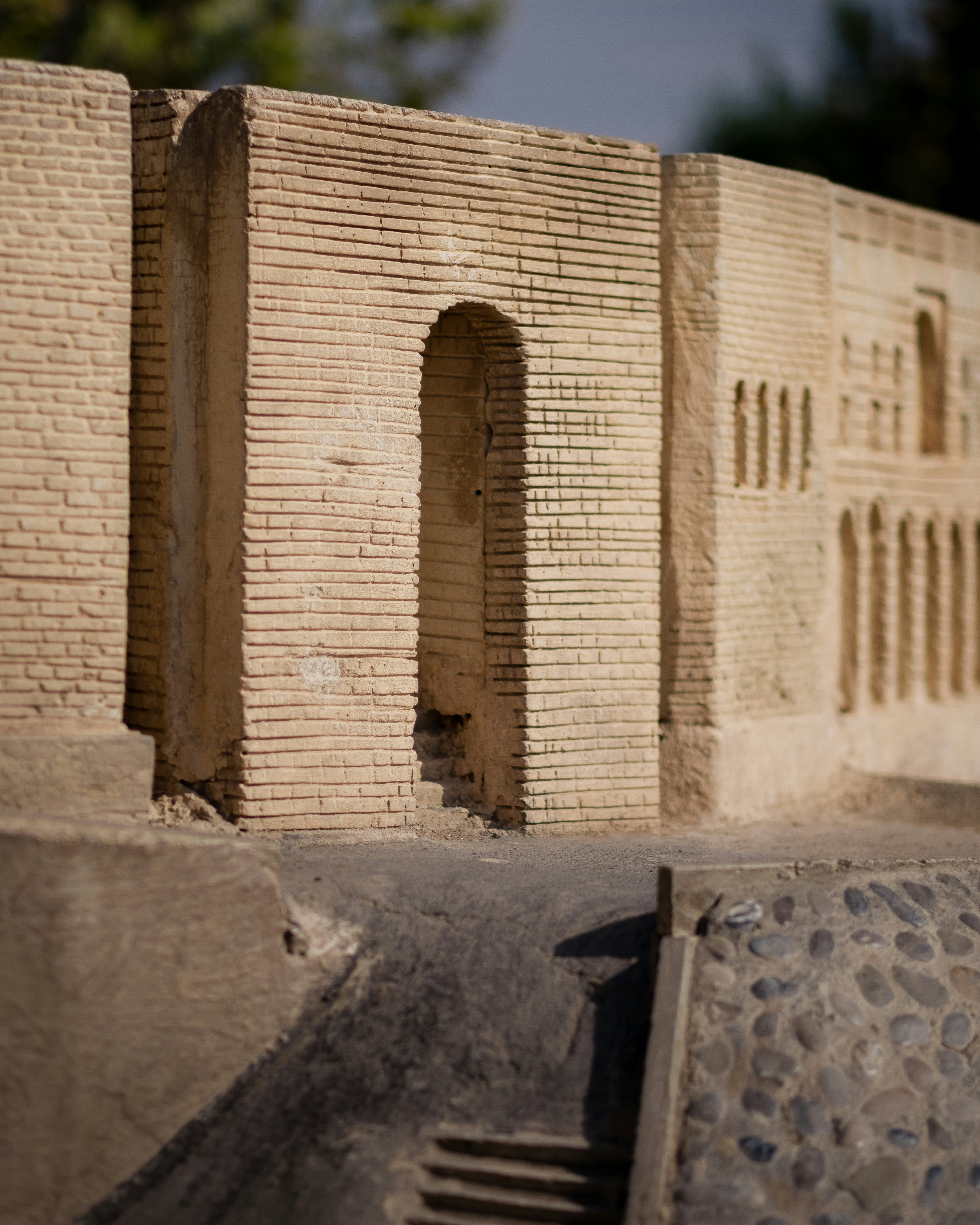 Sunlit Arches: A Quiet Corridor of Brick and Light