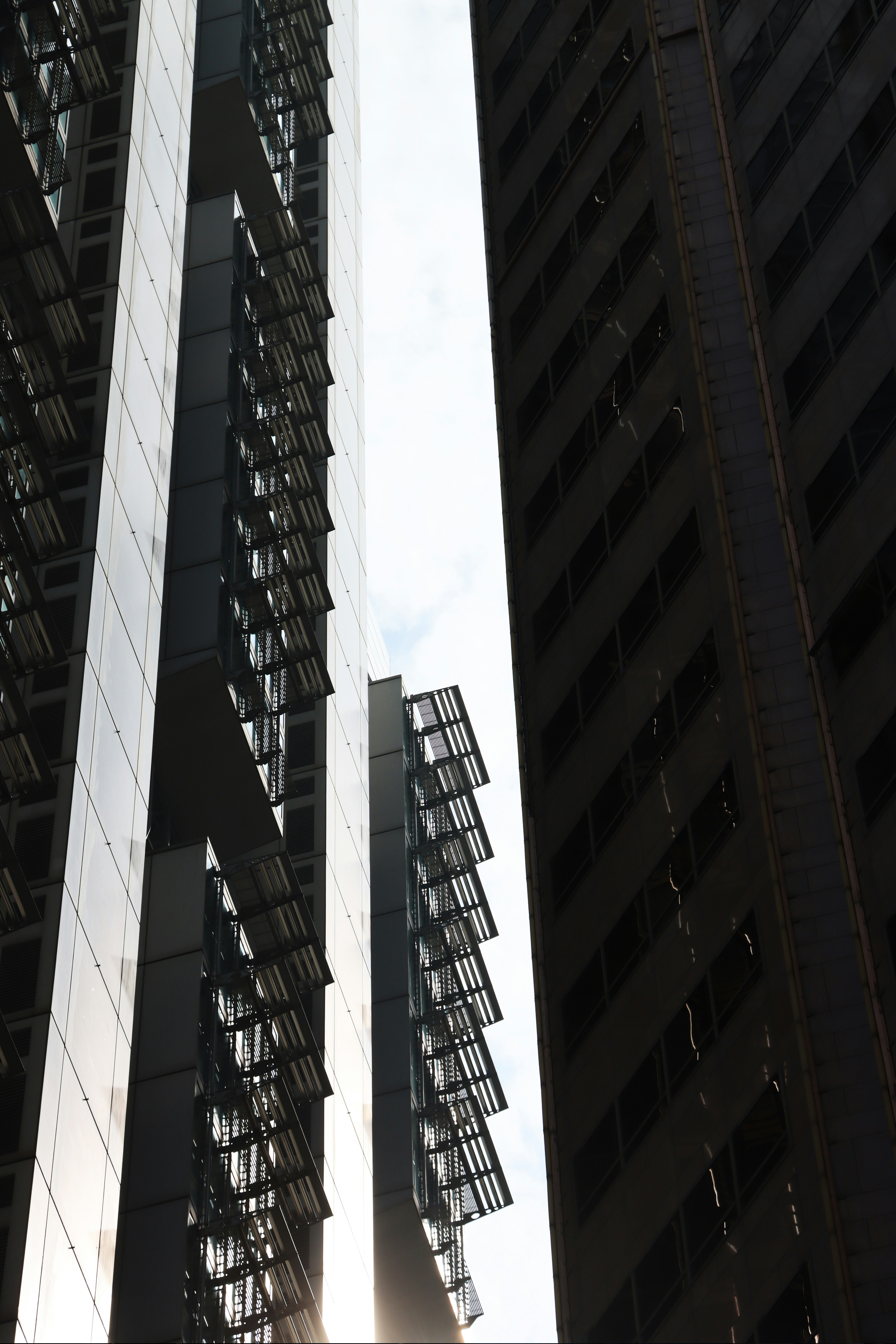 A couple of tall buildings next to each other photo – Free Hsbc ...