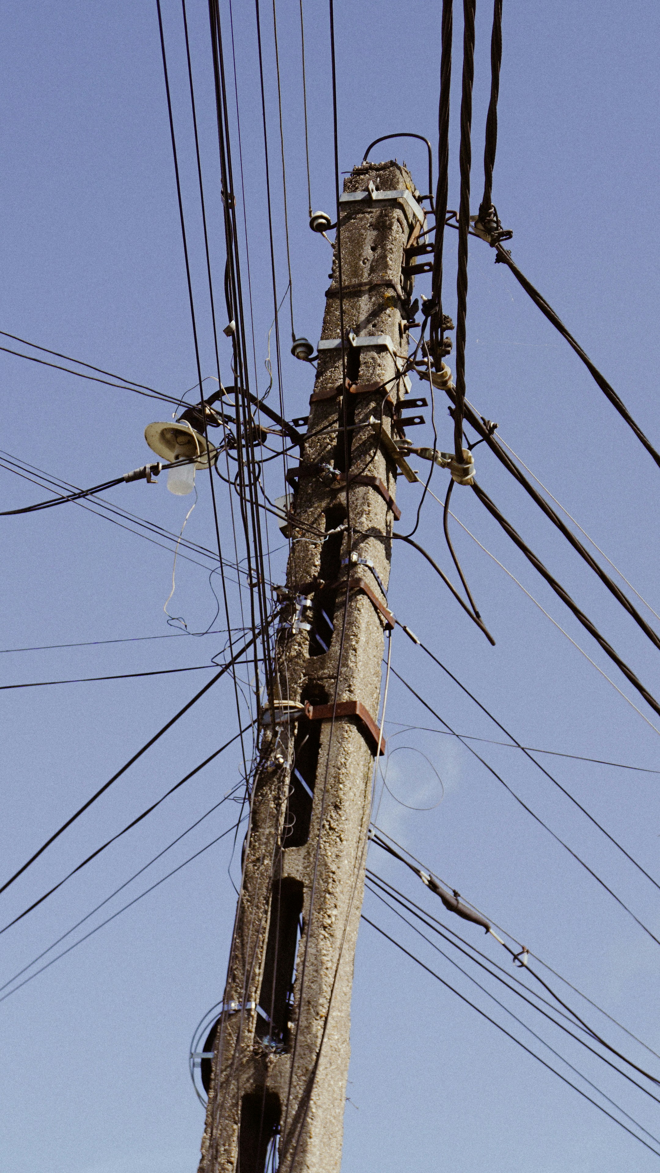 A telephone pole with a bunch of wires attached to it photo – Free ...