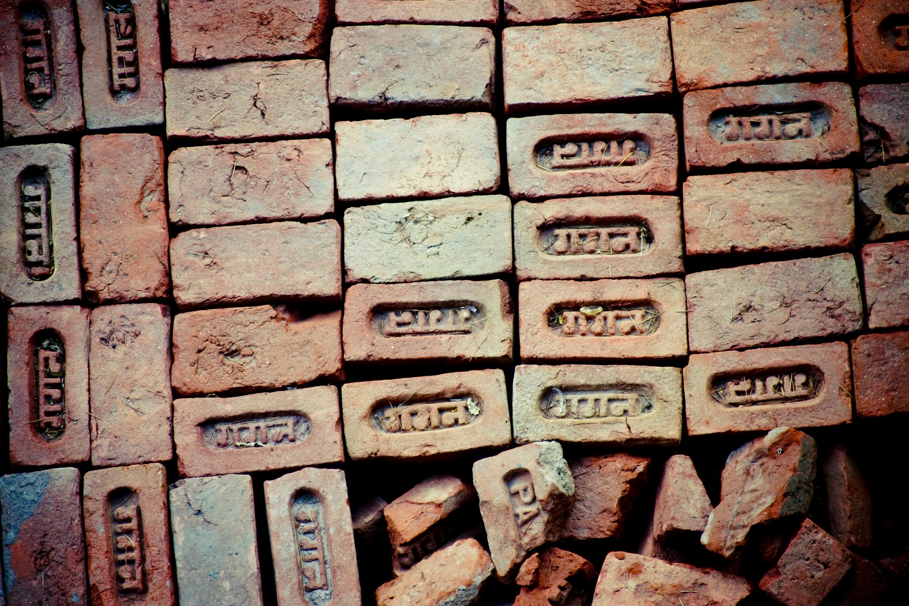A pile of bricks that have been stacked together photo – Free India ...