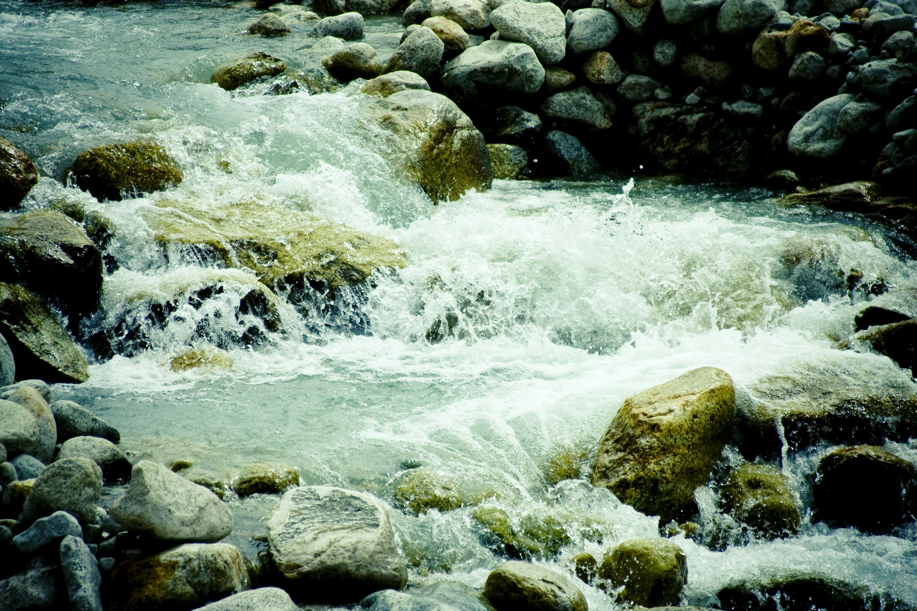 A river with rocks and water running over it photo – Free India Image ...