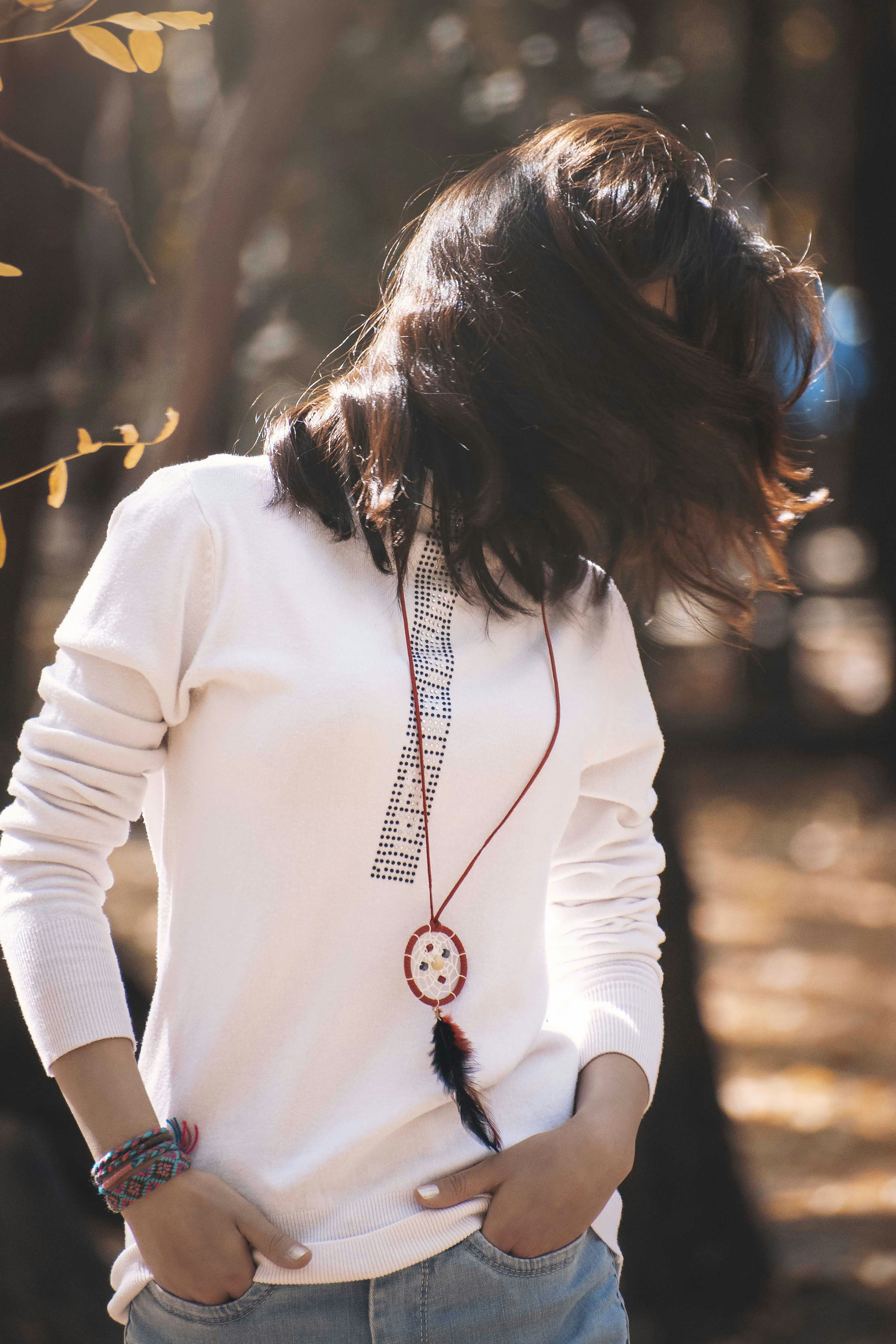 Sunlit Whorl: Hair in Motion Meets a Bohemian Pendant in the Autumn Woods