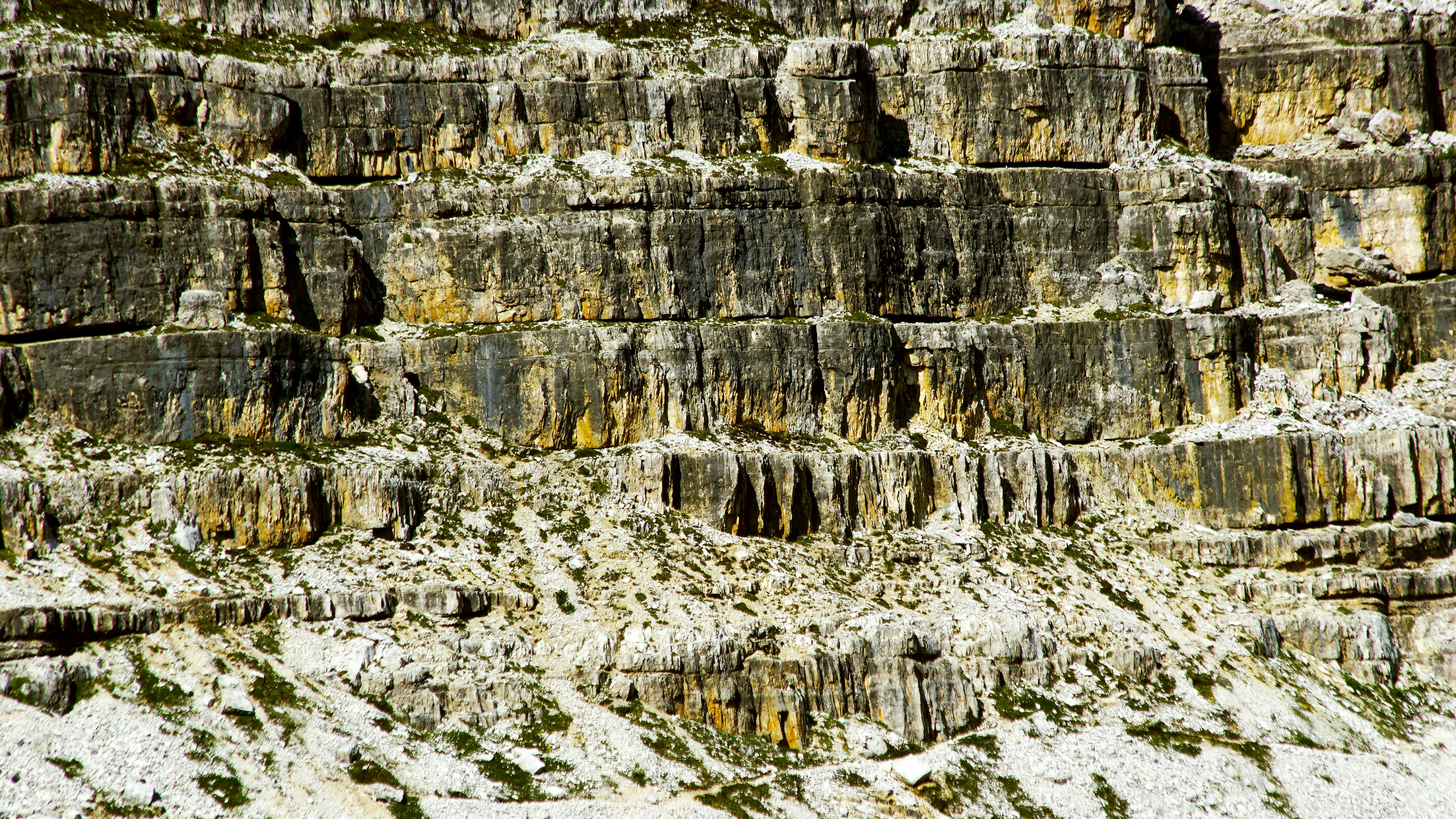 A mountain with a very tall cliff in the middle of it photo – Free ...