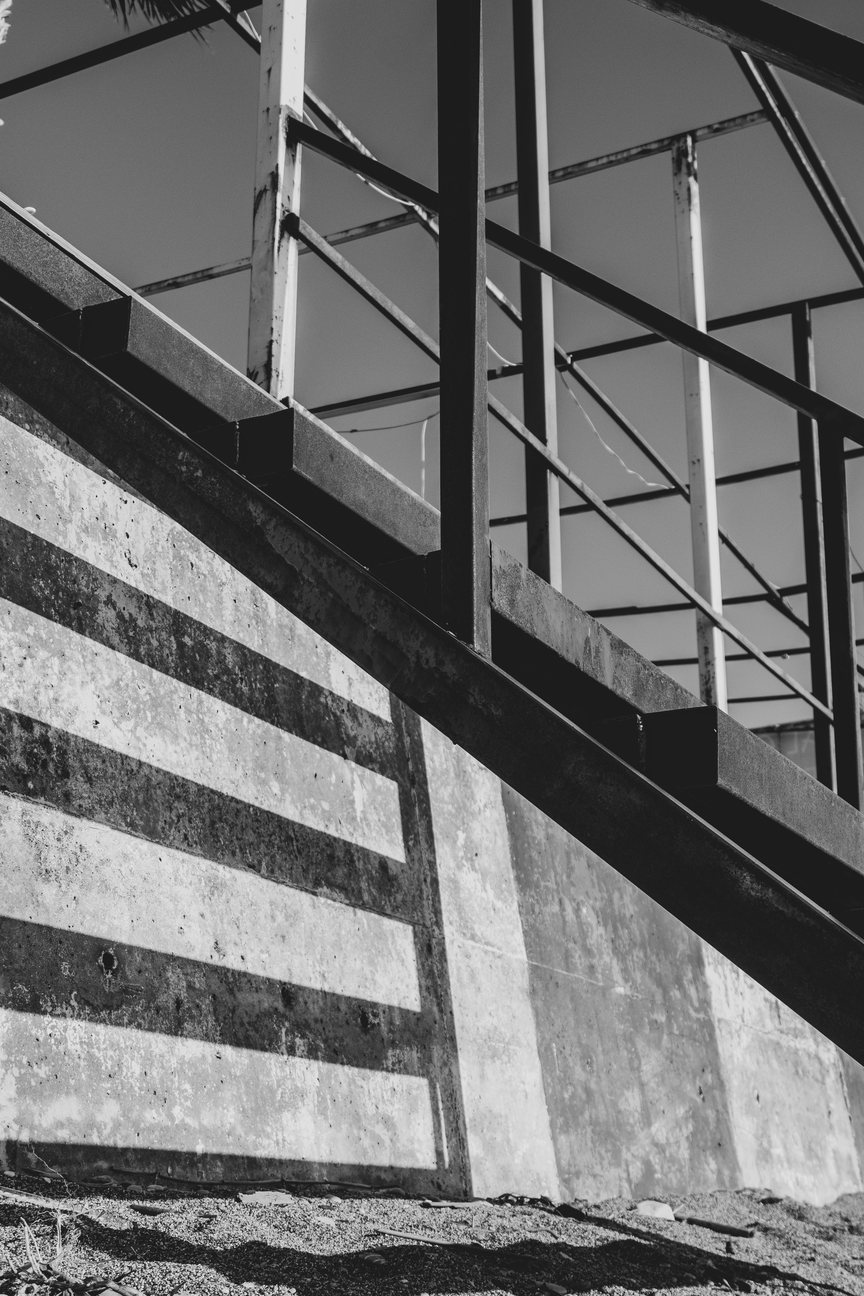 A man riding a skateboard down the side of a ramp photo – Free Banister ...