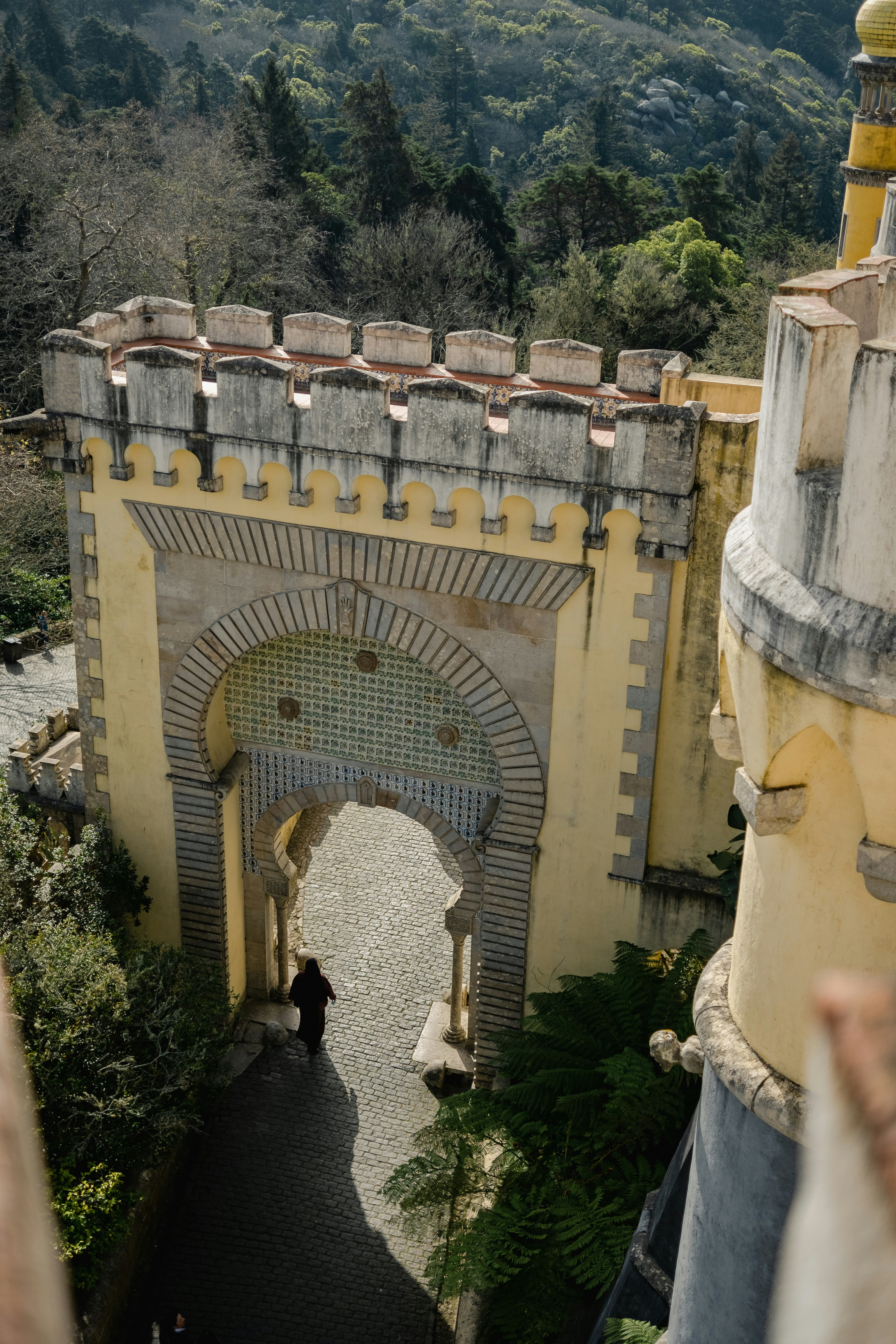 The portal at Sintra in Portugal with a women passing.