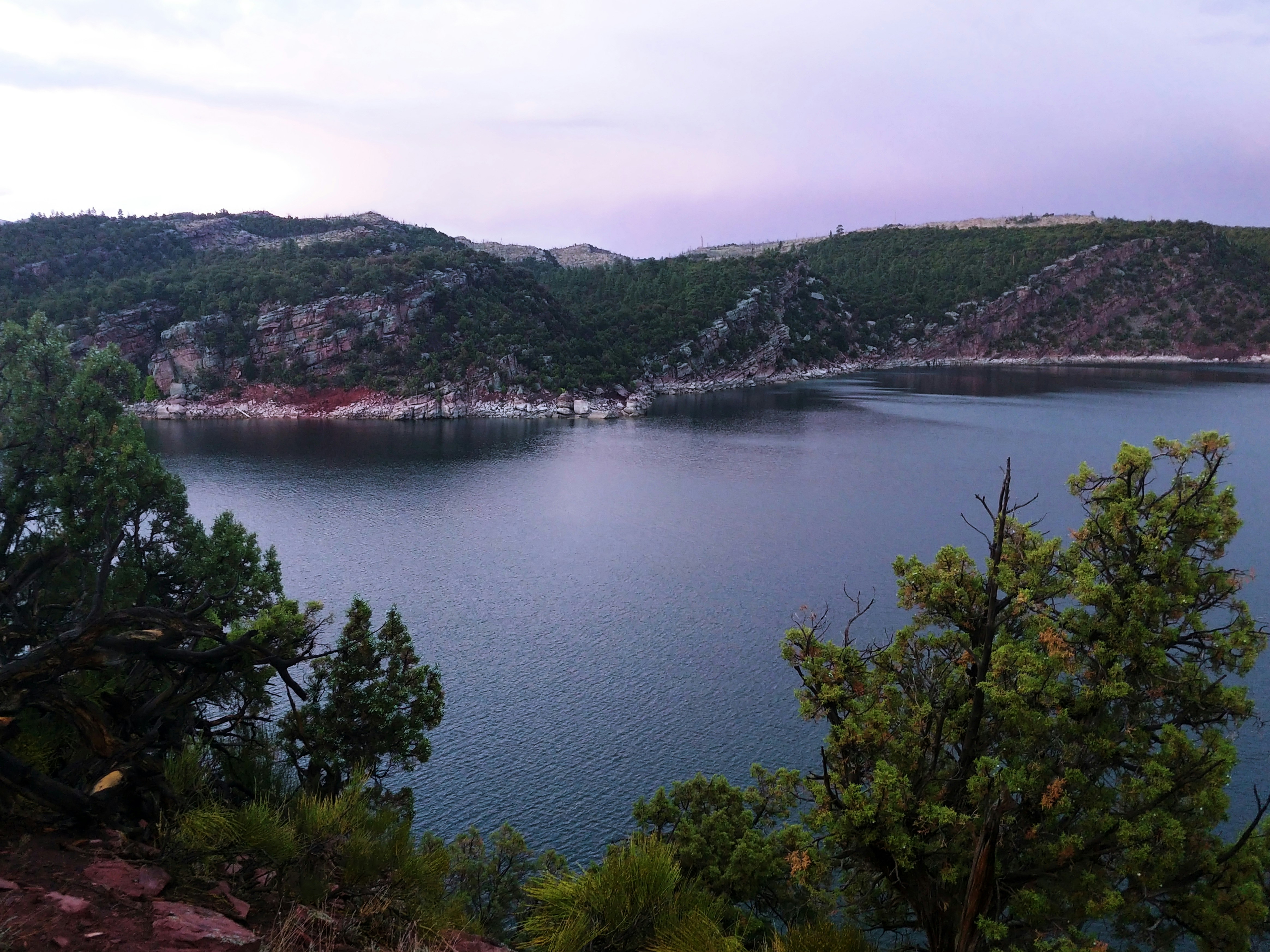 Flaming Gorge | a large body of water surrounded by trees