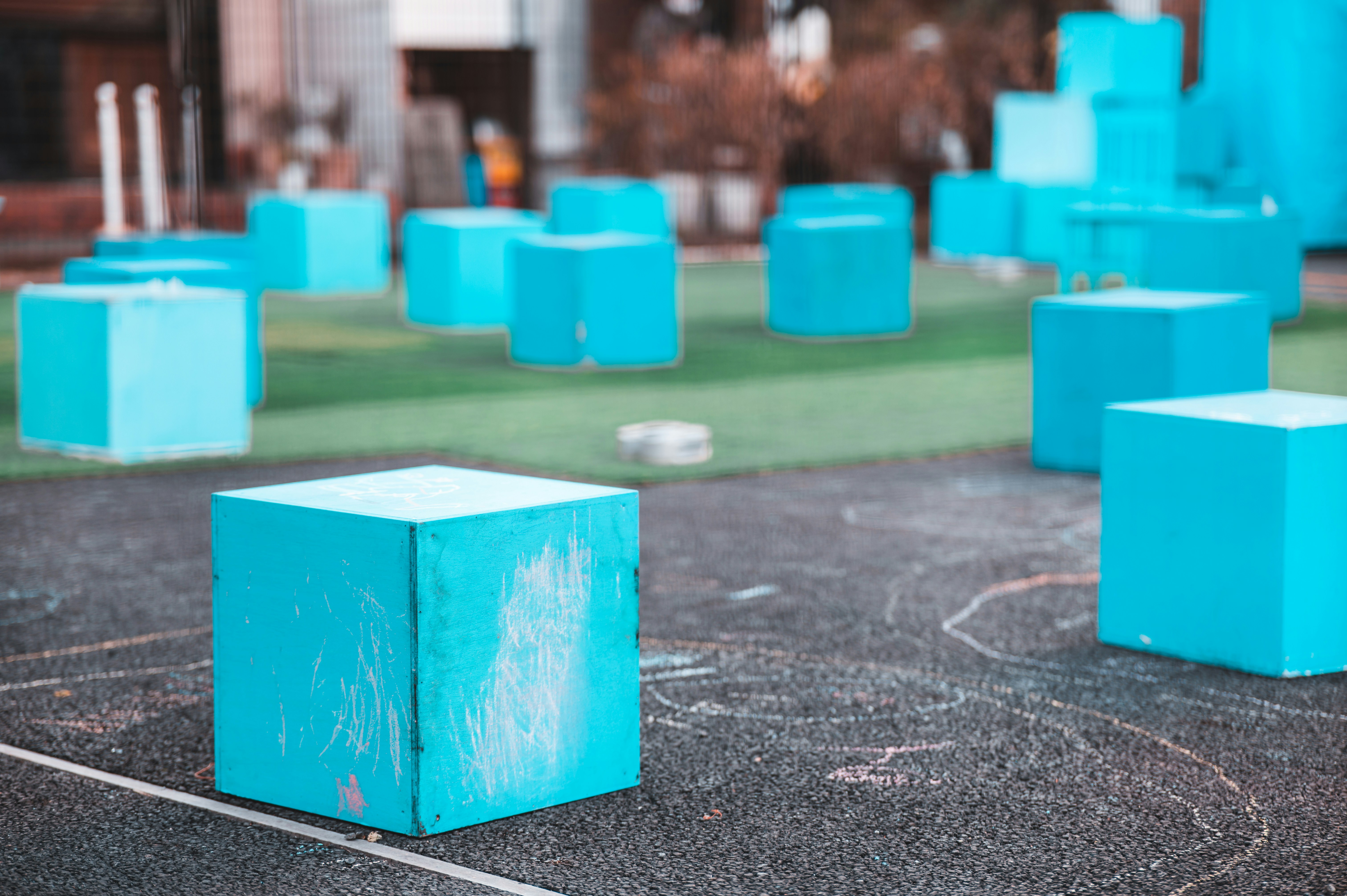 A group of blue boxes sitting on top of a basketball court photo – Free ...