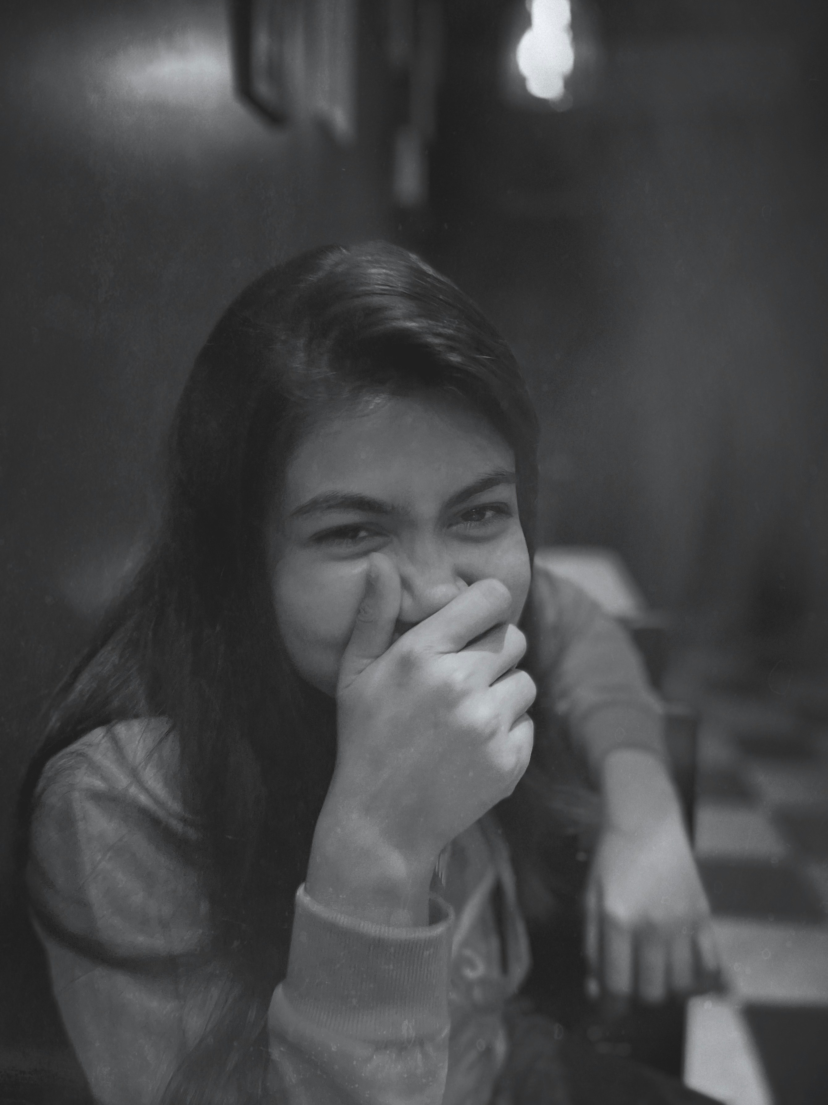 A young girl covers her face with her hands photo – Free India Image on ...