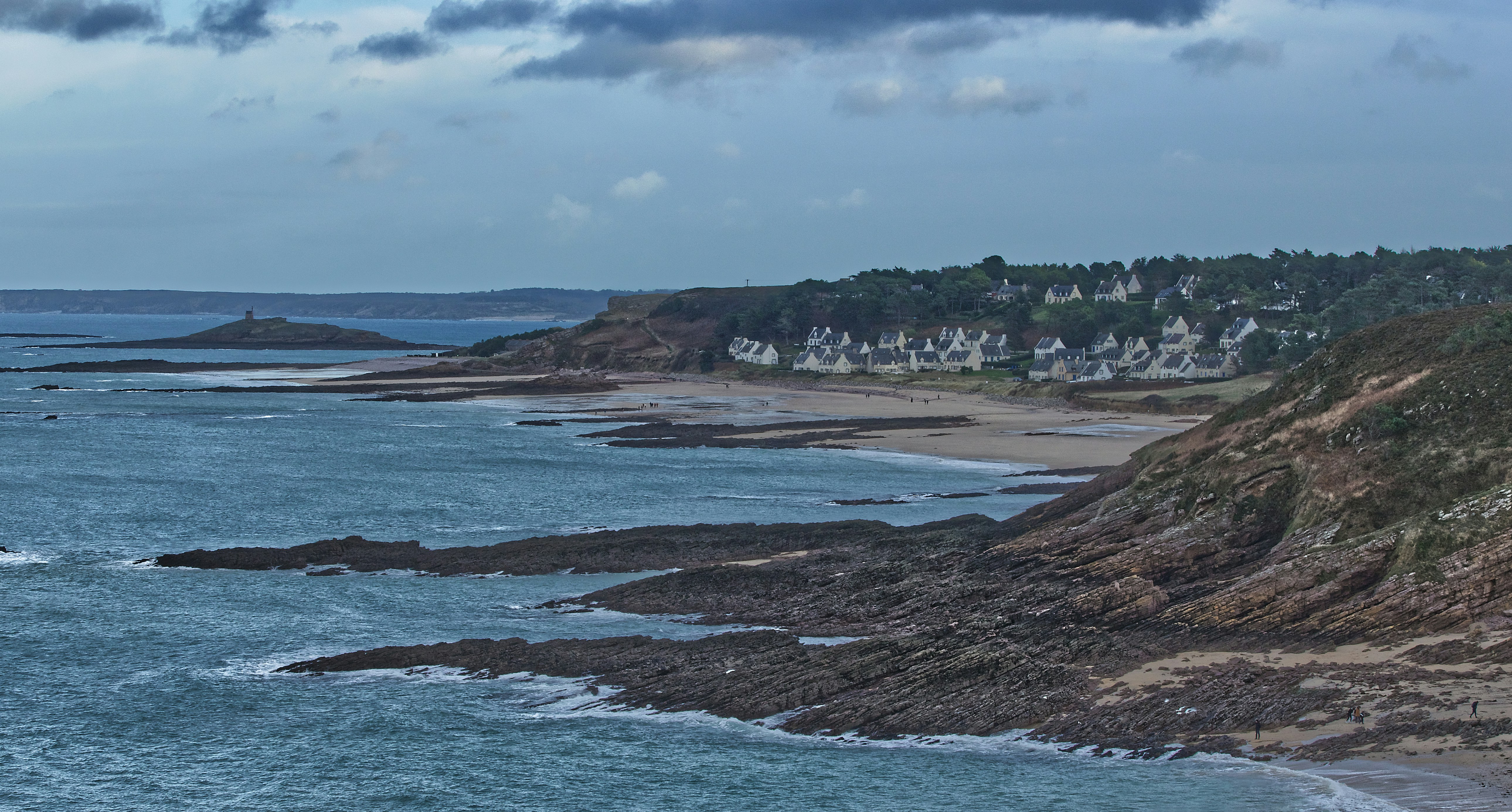 Coastal Ridge at Dusk: Cliffside Village in the Distance