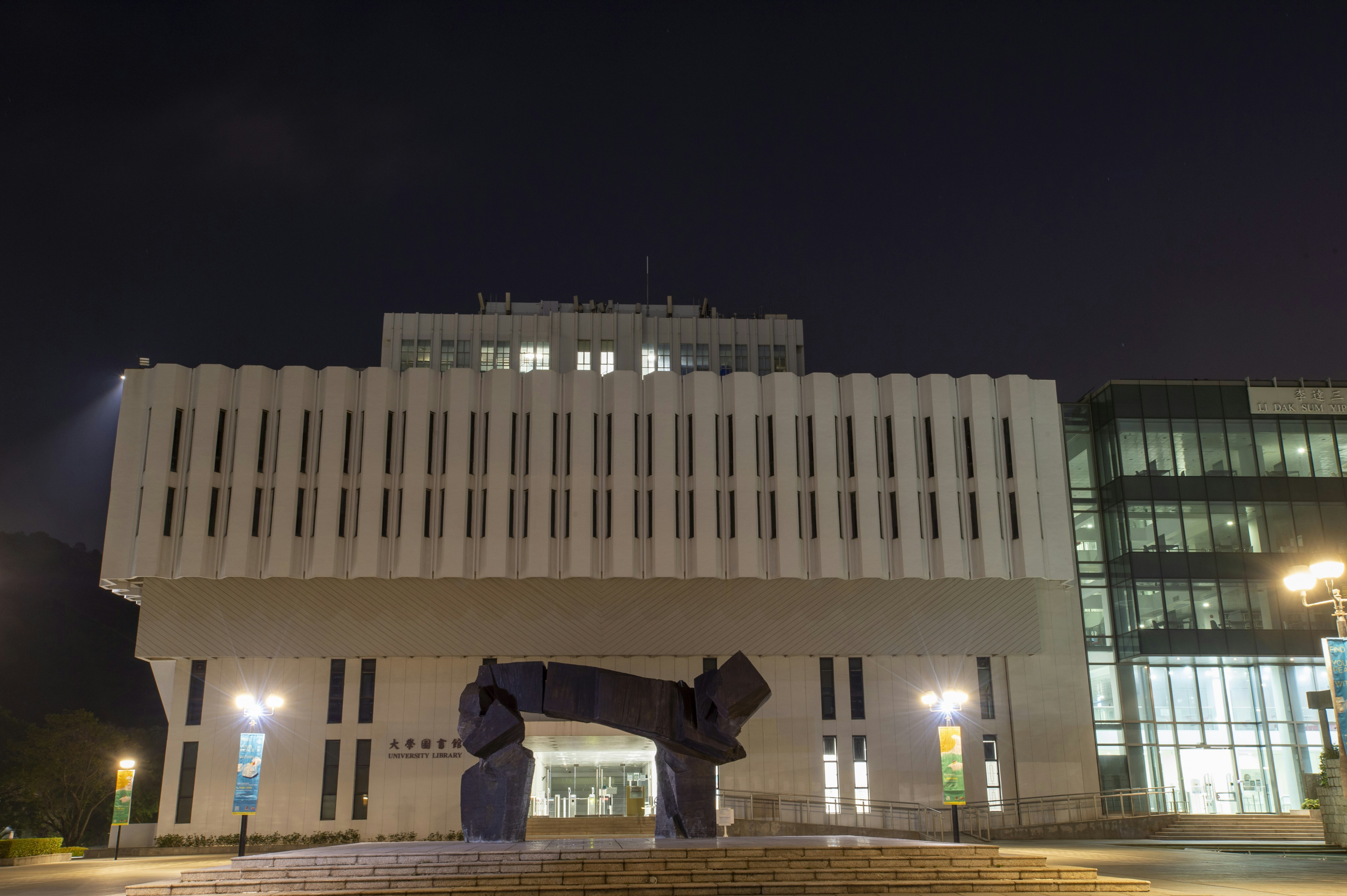 a large white building with a statue in front of it