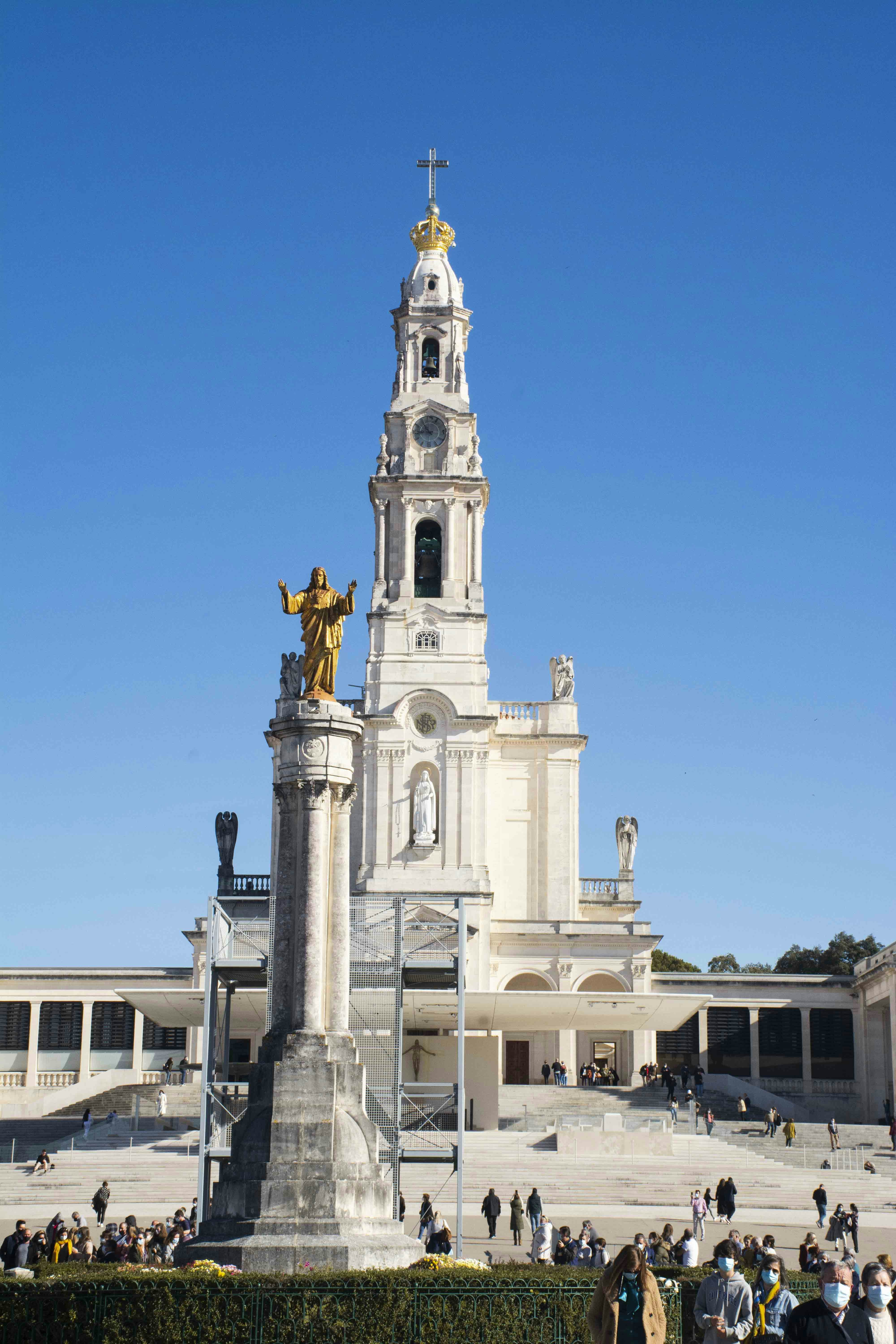 A large white building with a clock tower photo – Free Fatima Image on ...