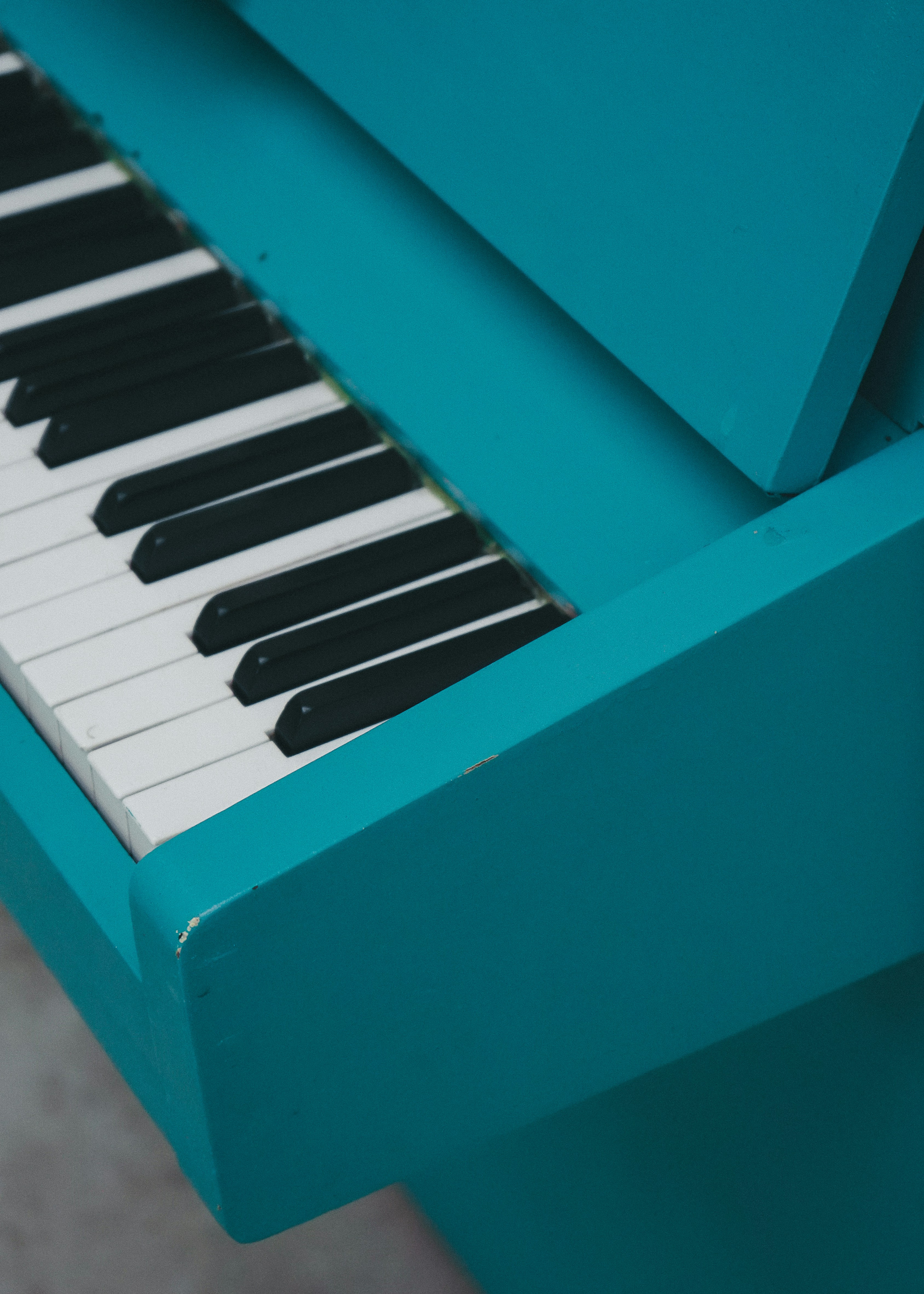 Minty Teal Keys: Close-Up on a Modern Piano’s Geometry