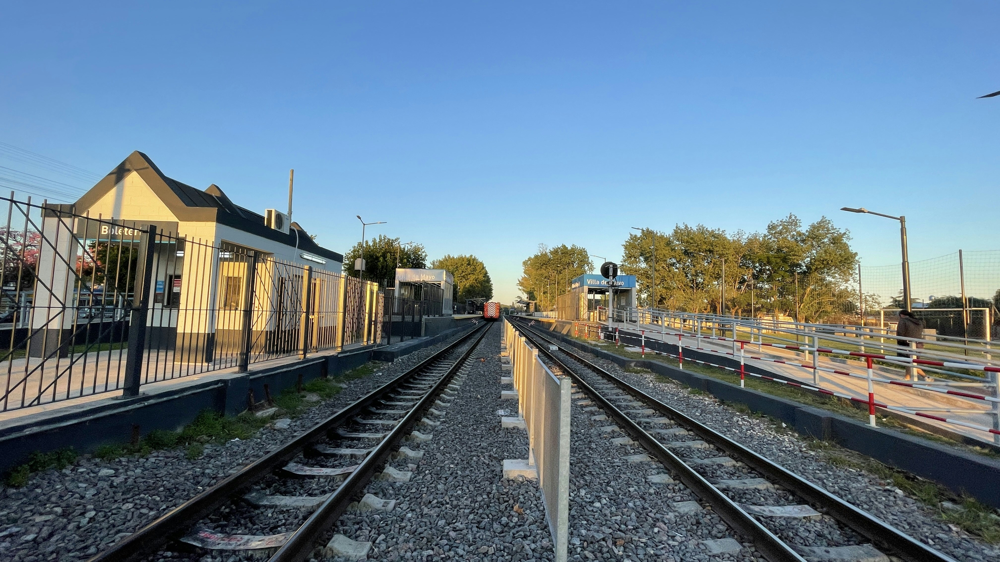 Railway Horizon: Tracks Converge Under a Clear Skies