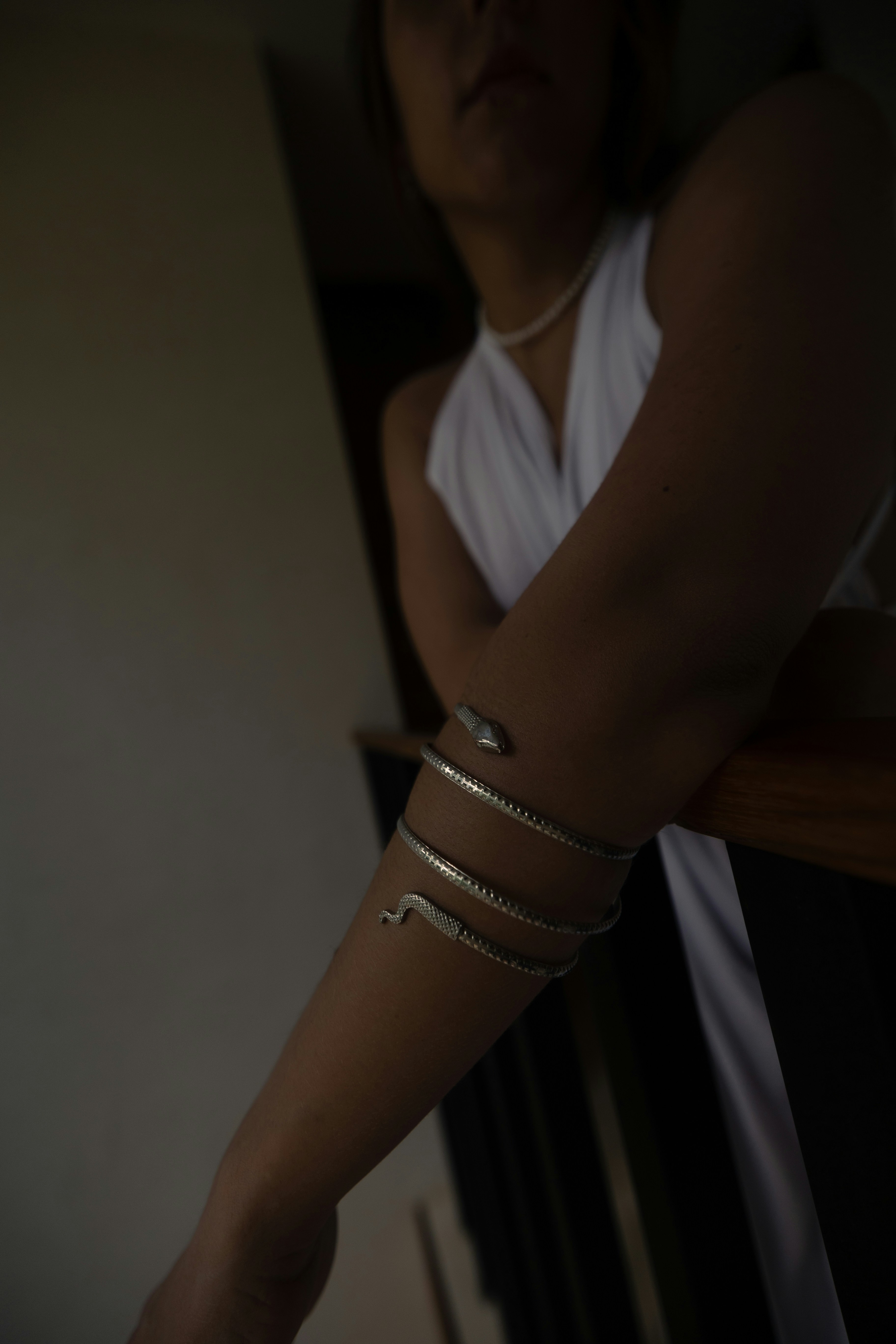 a woman with a bracelet on her arm