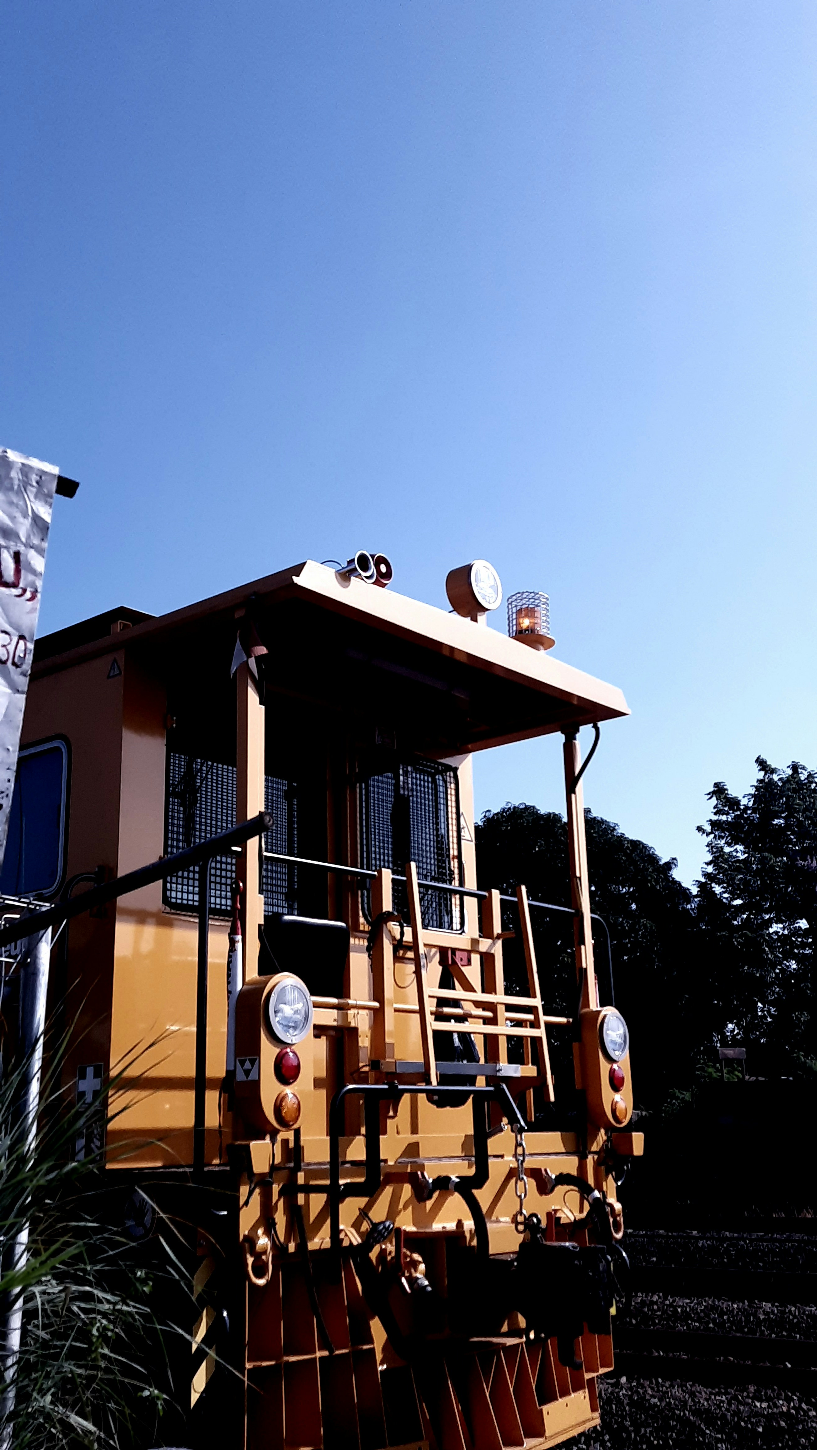 Front-On Freight: Daylight Portrait of a Yellow Locomotive