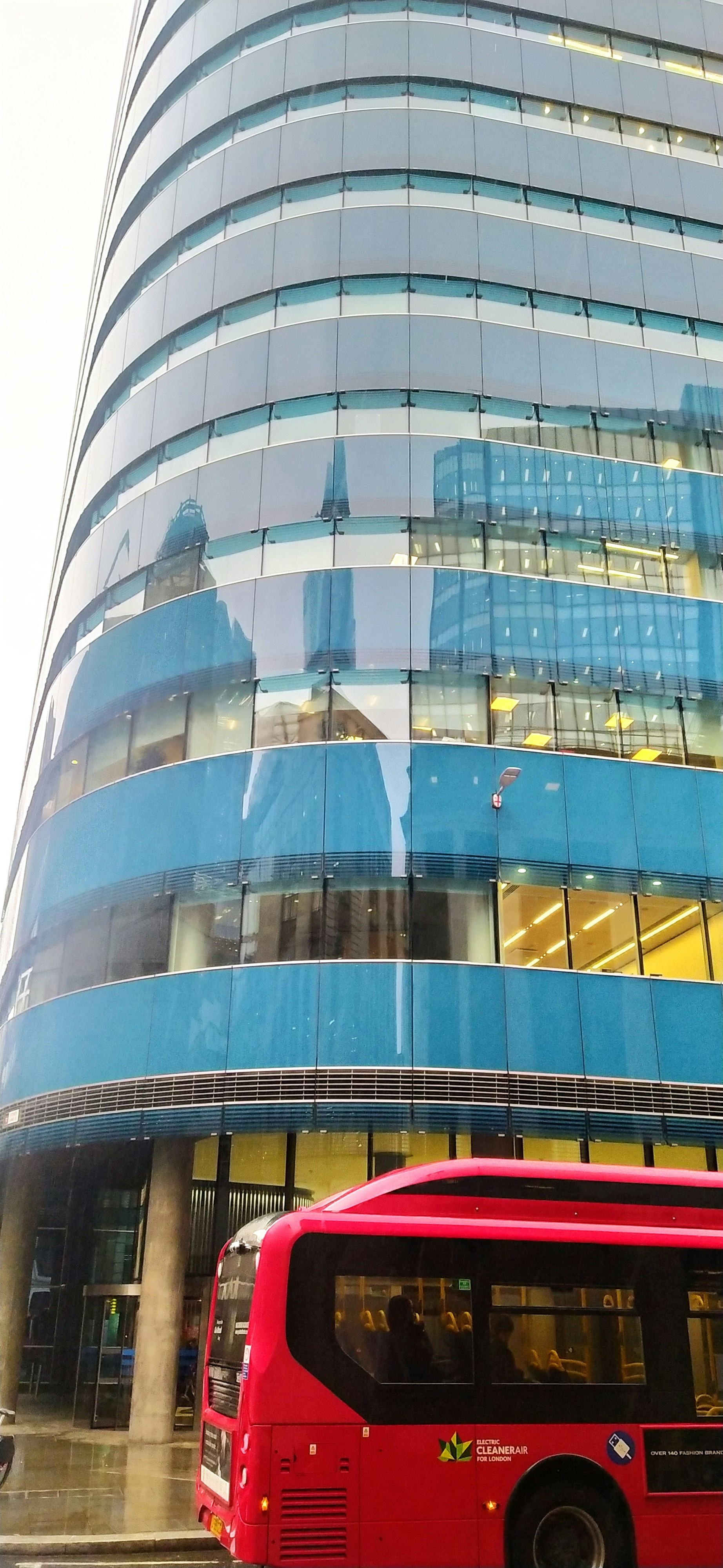 A red bus parked in front of a tall building photo – Free London city ...