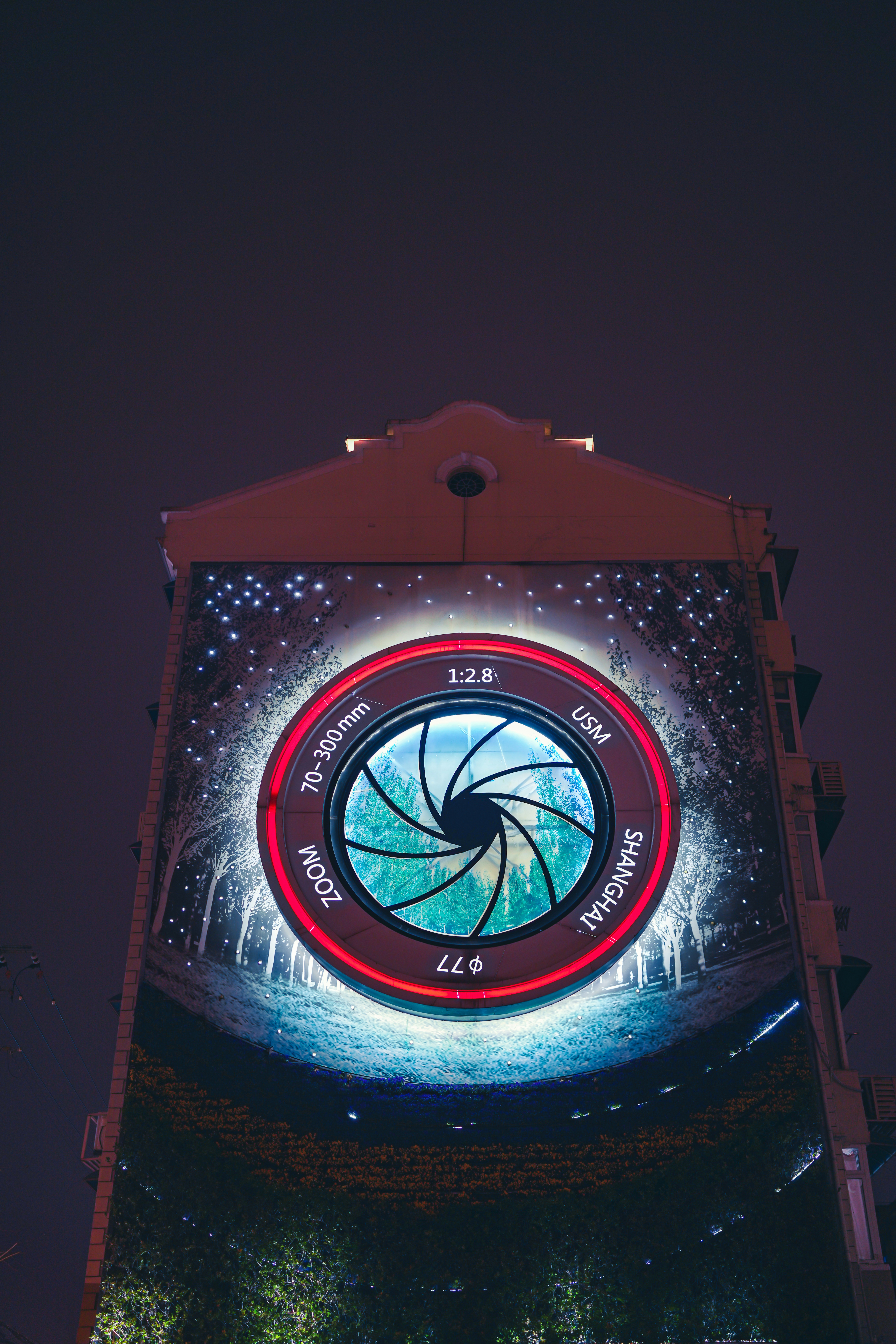 a large clock tower with a circular design on it's side