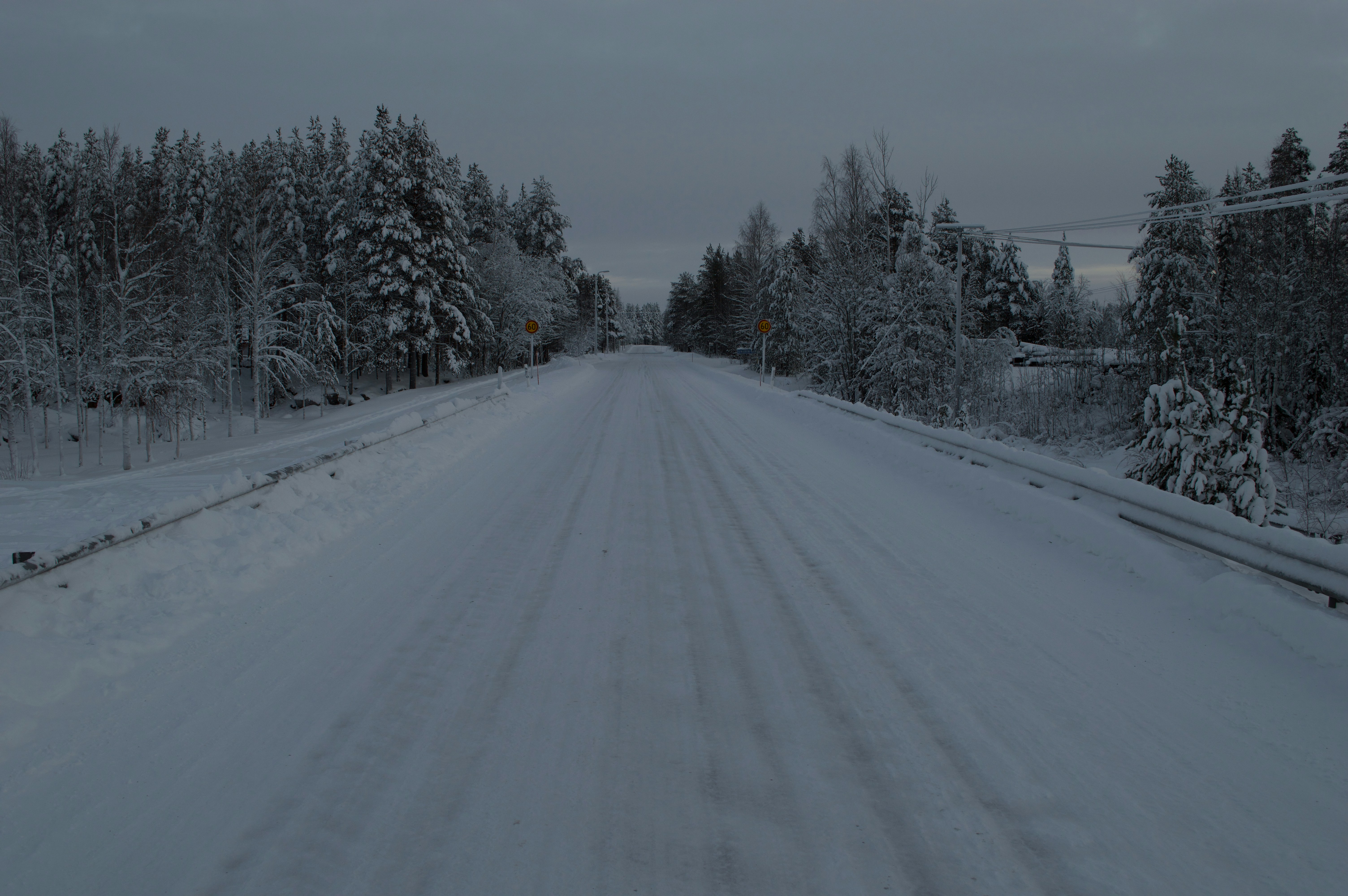 A road is covered in snow and trees photo – Free Lapland Image on Unsplash