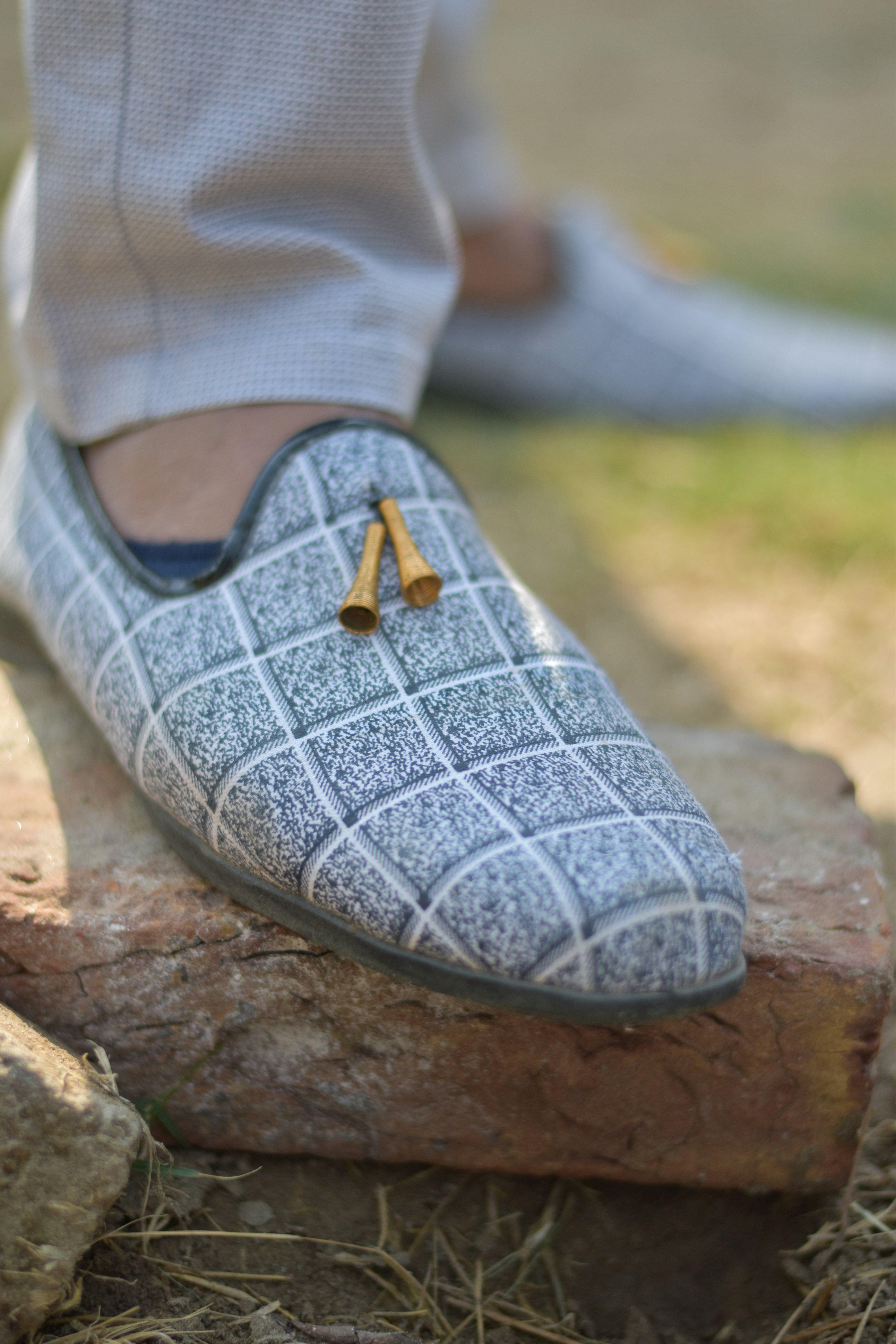 Patterned Slip-on on Brick Stair: a Casual Step into Detail