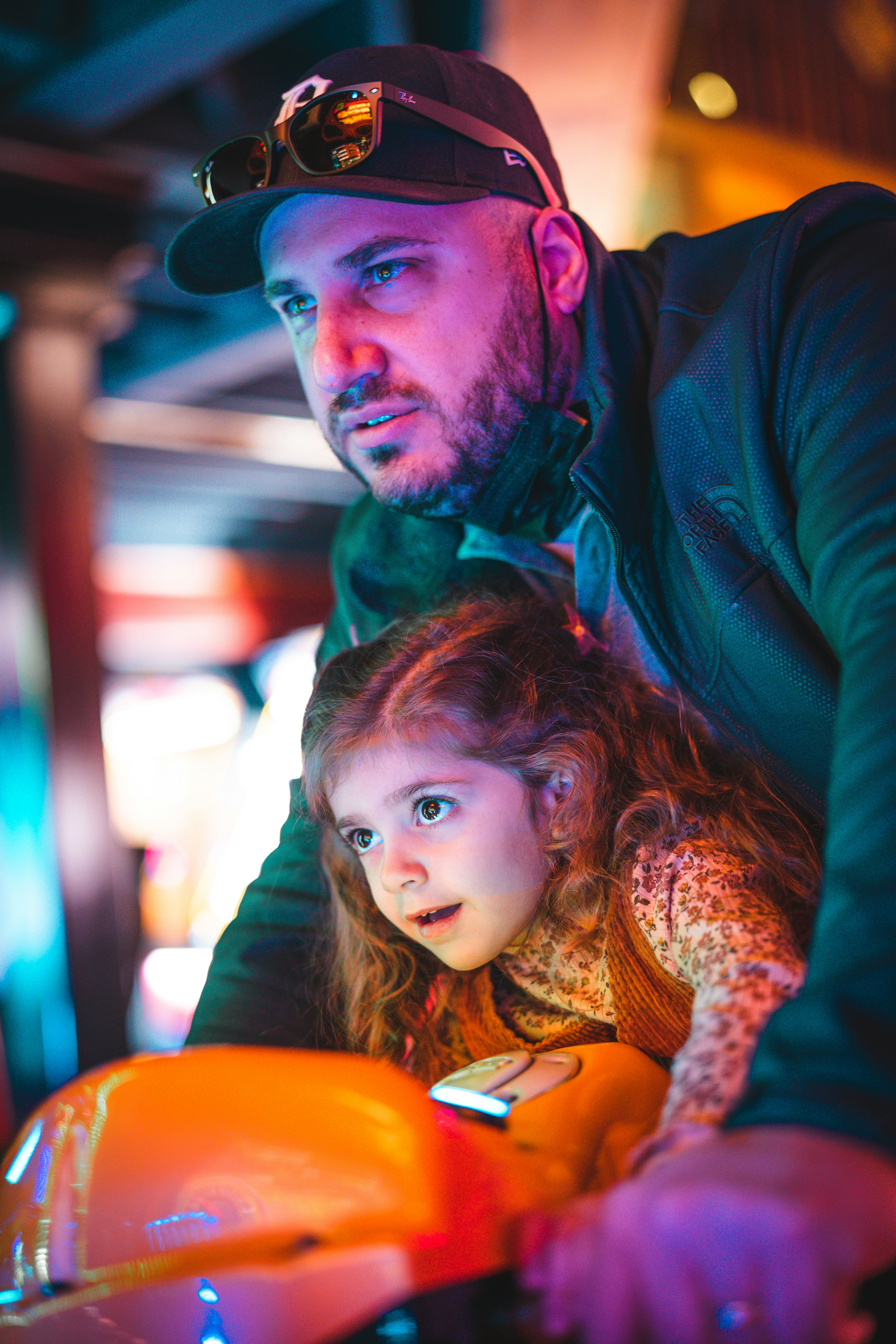 Father and Daughter On a Neon Ride