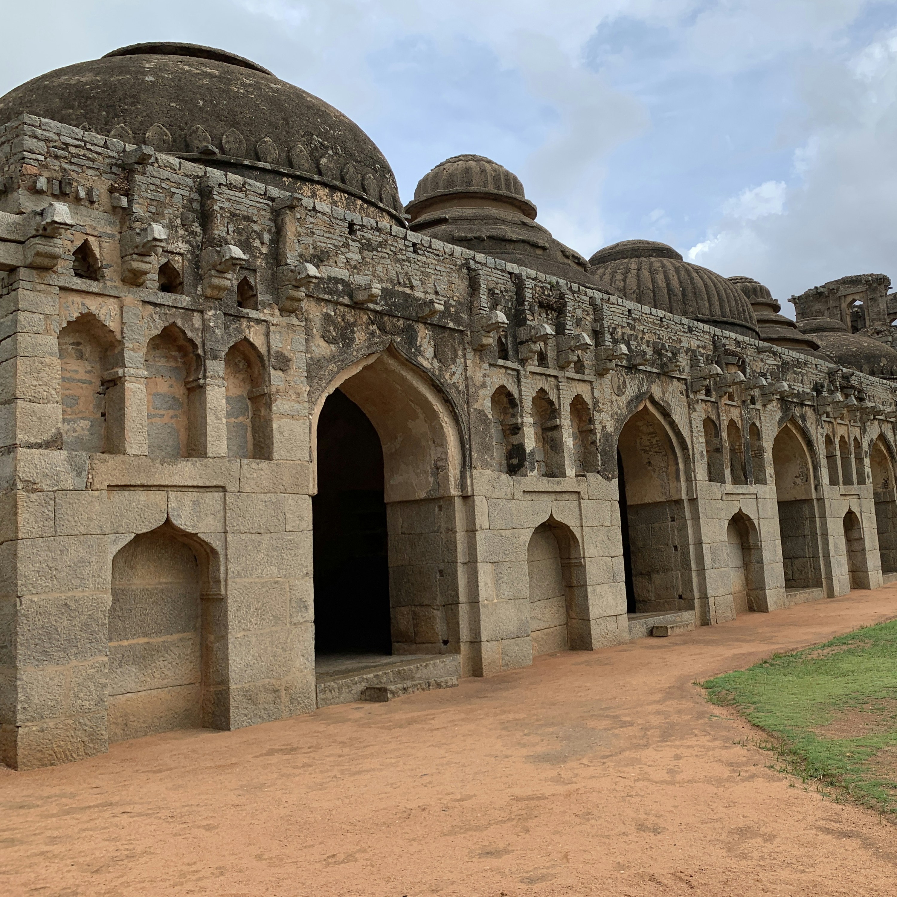 A large stone building with many arches and domes photo – Free ...