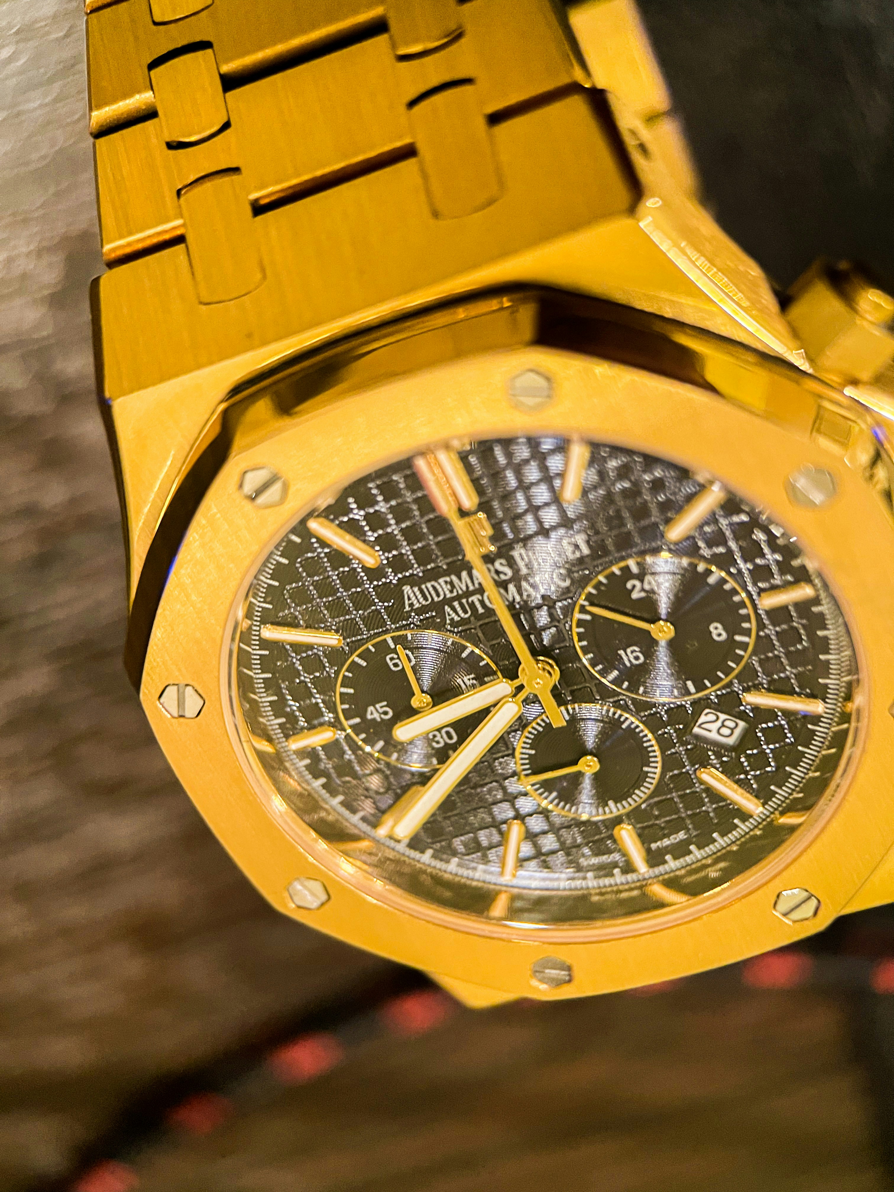 A gold watch with a black face and yellow hands photo – Free Macro ...
