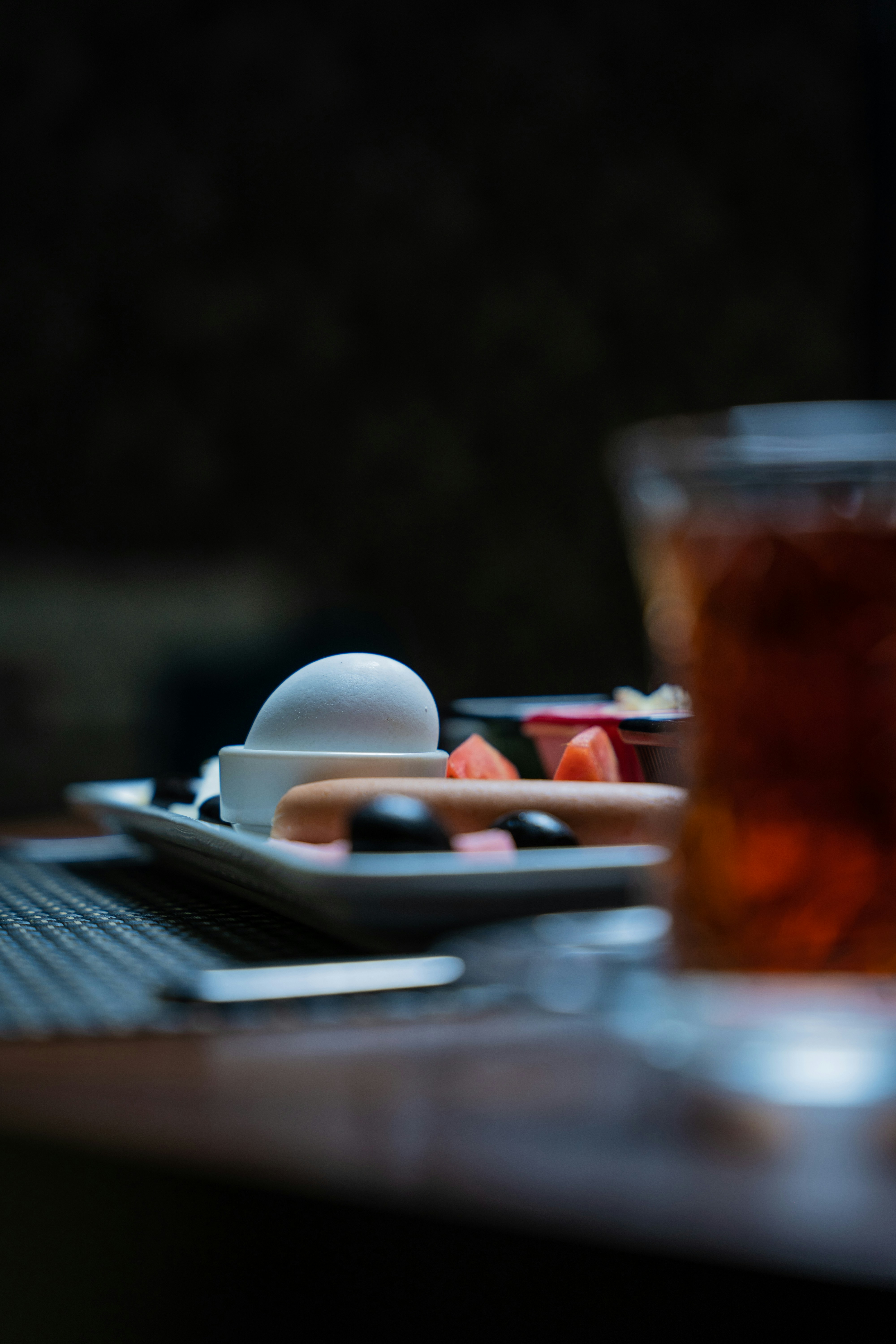 Egg on a Saucer: Quiet Focus Amid a Bar-Top Spread