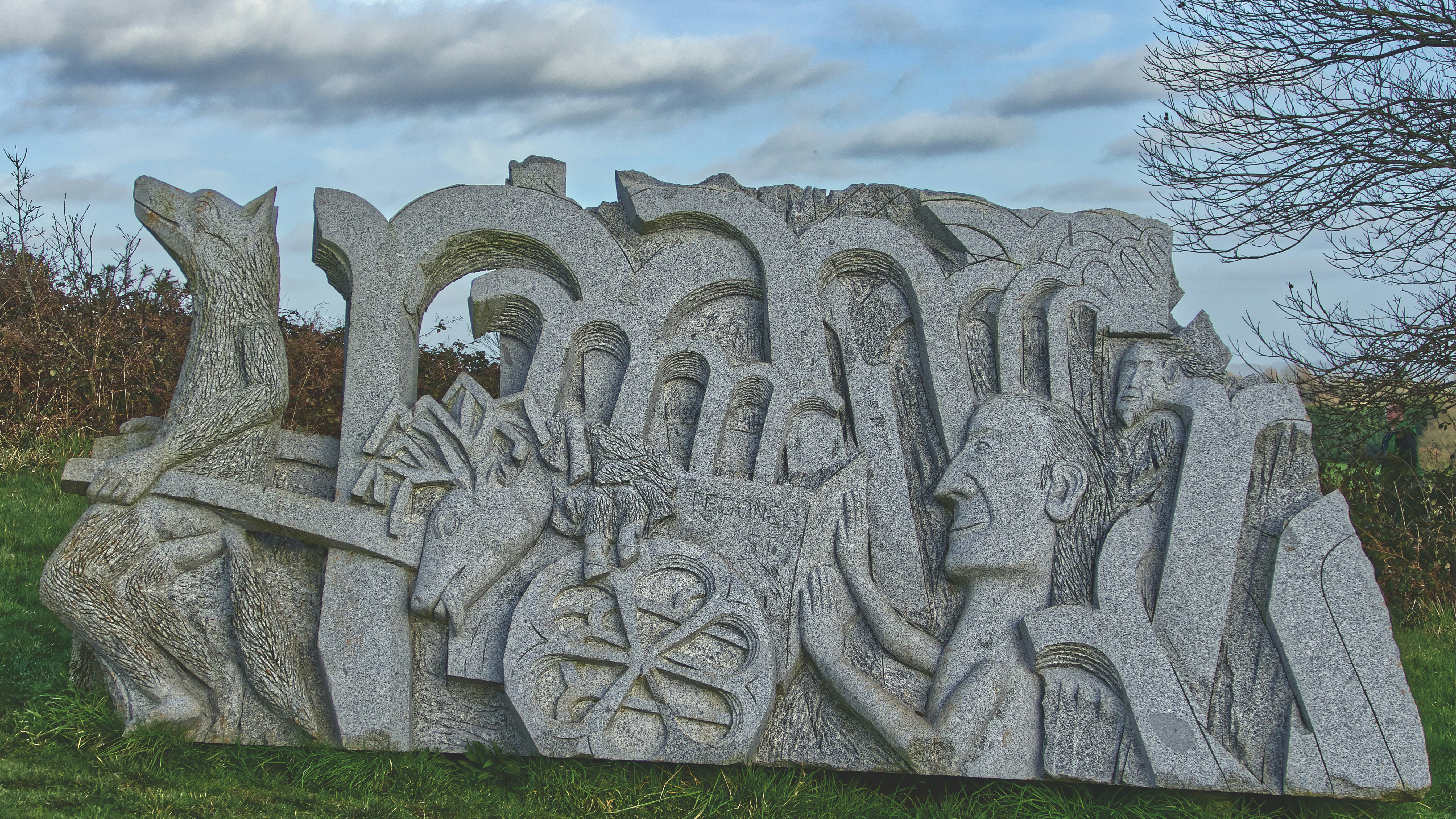 A large stone sculpture of a group of people photo – Free France Image ...