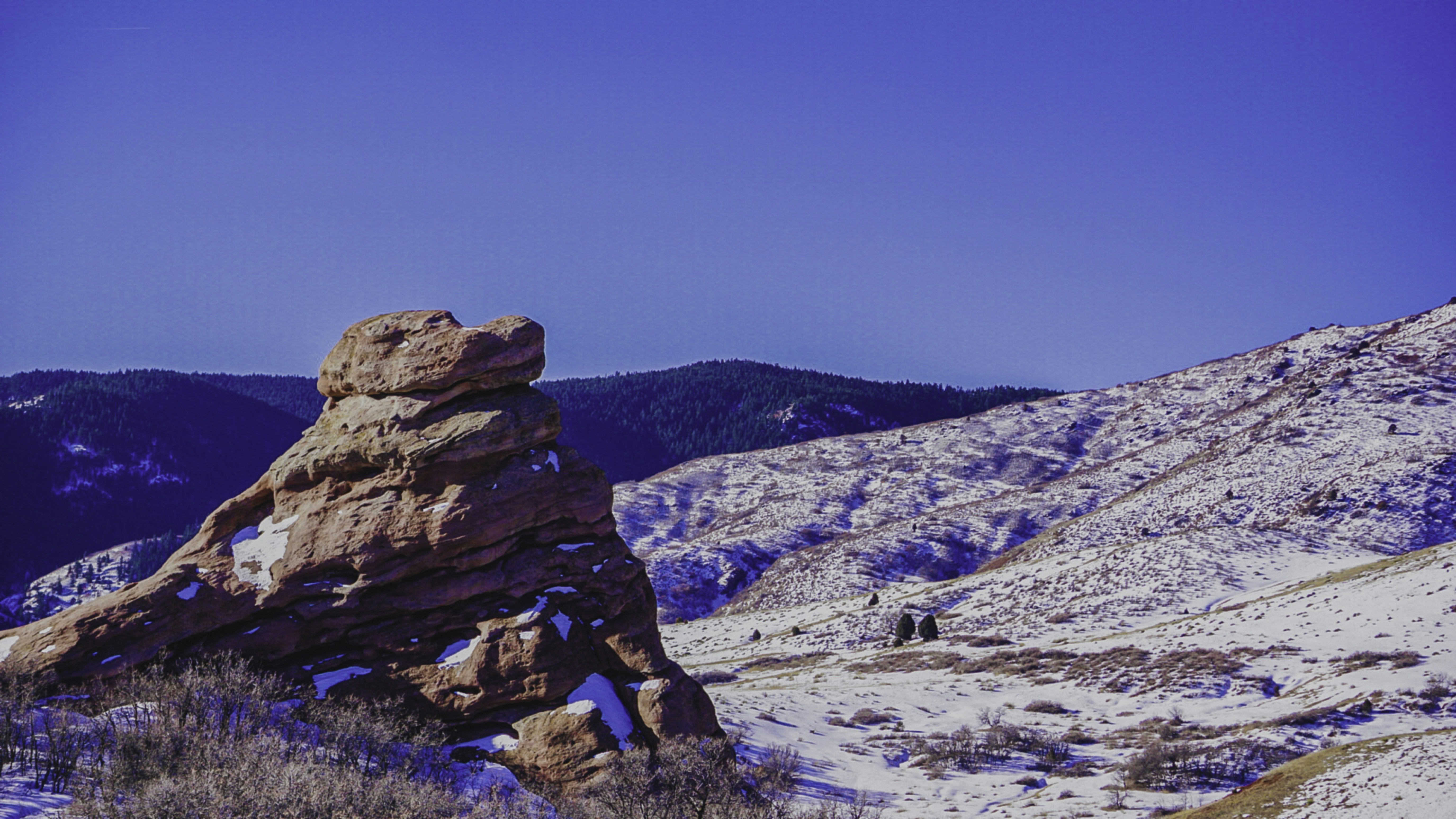 A large rock in the middle of a snowy field photo – Free South valley ...