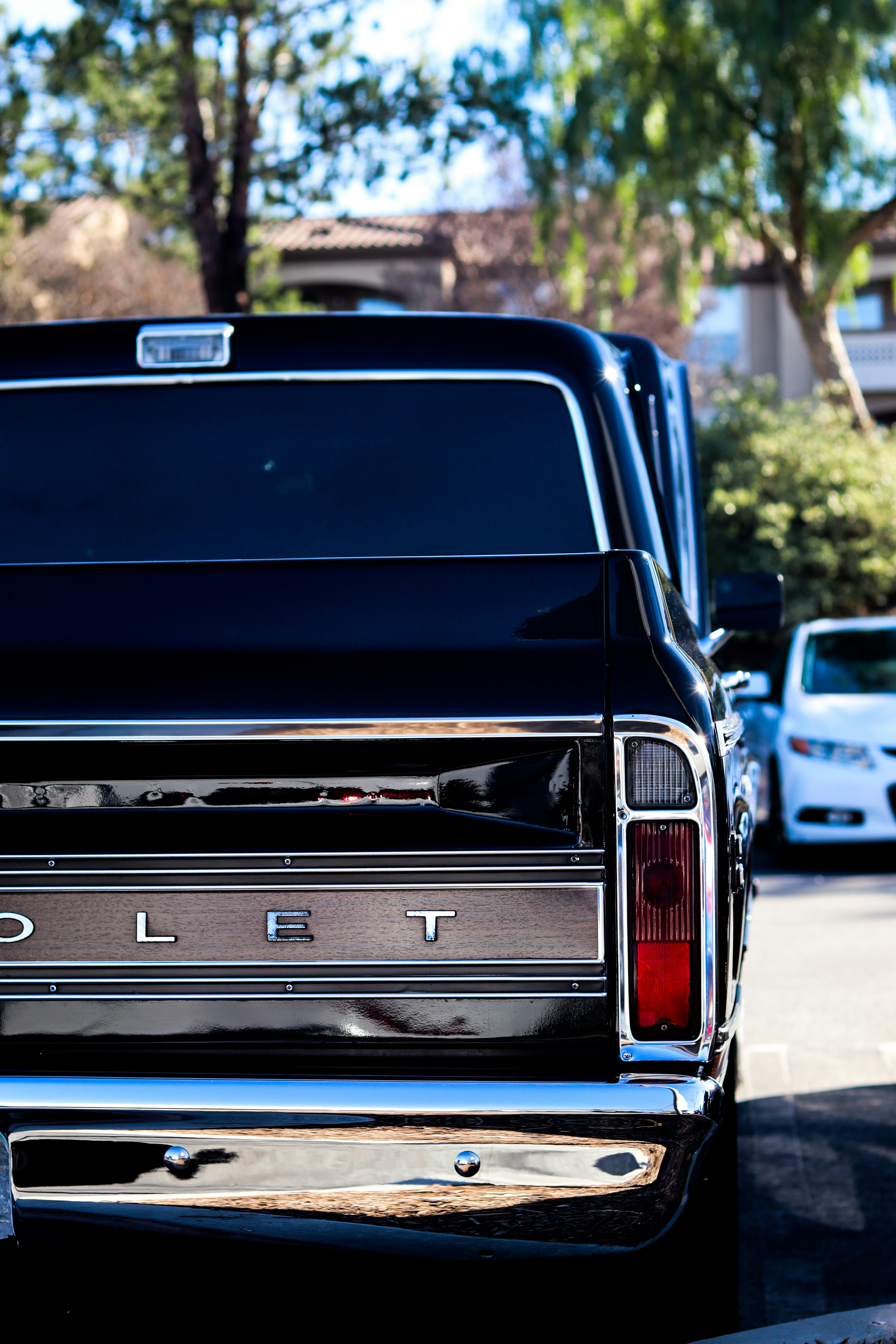Chrome and Shadow: The Back of a Classic Ford Truck