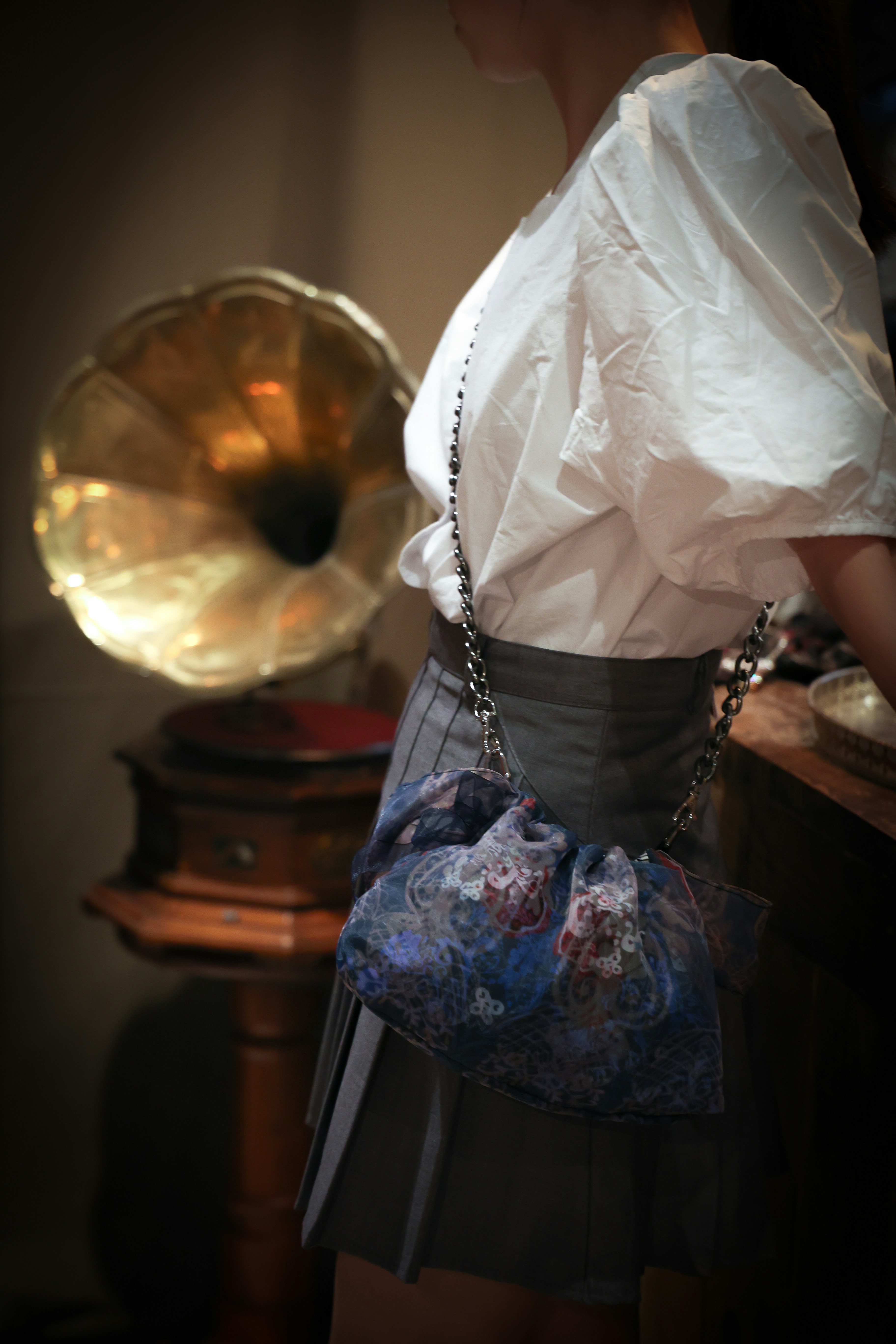 Soft Light, Brass Echoes: A Side Portrait with a Vintage Gramophone