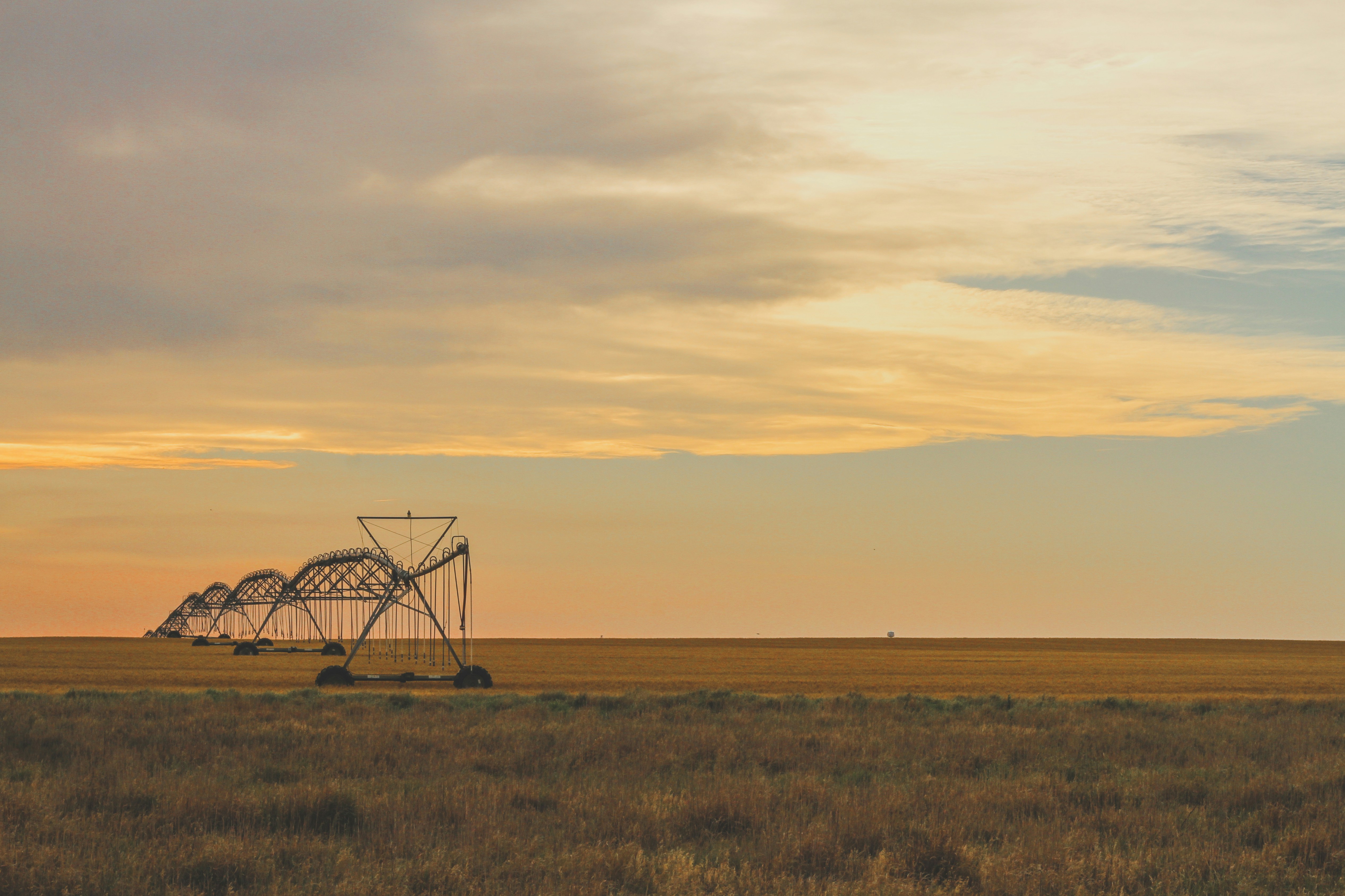 A large metal structure in the middle of a field photo – Free Field ...