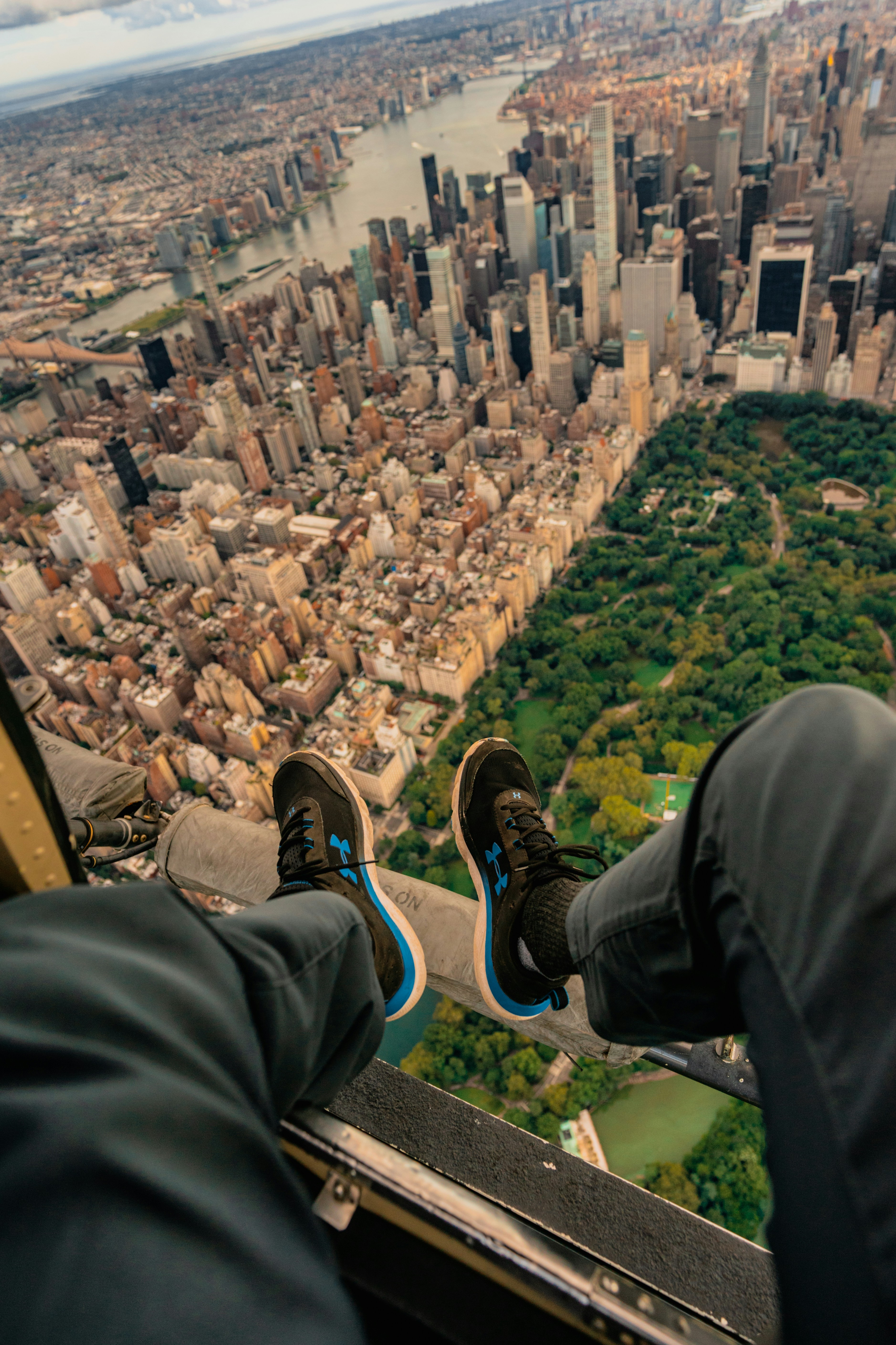 A person standing on the edge of a tall building photo – Free Central ...