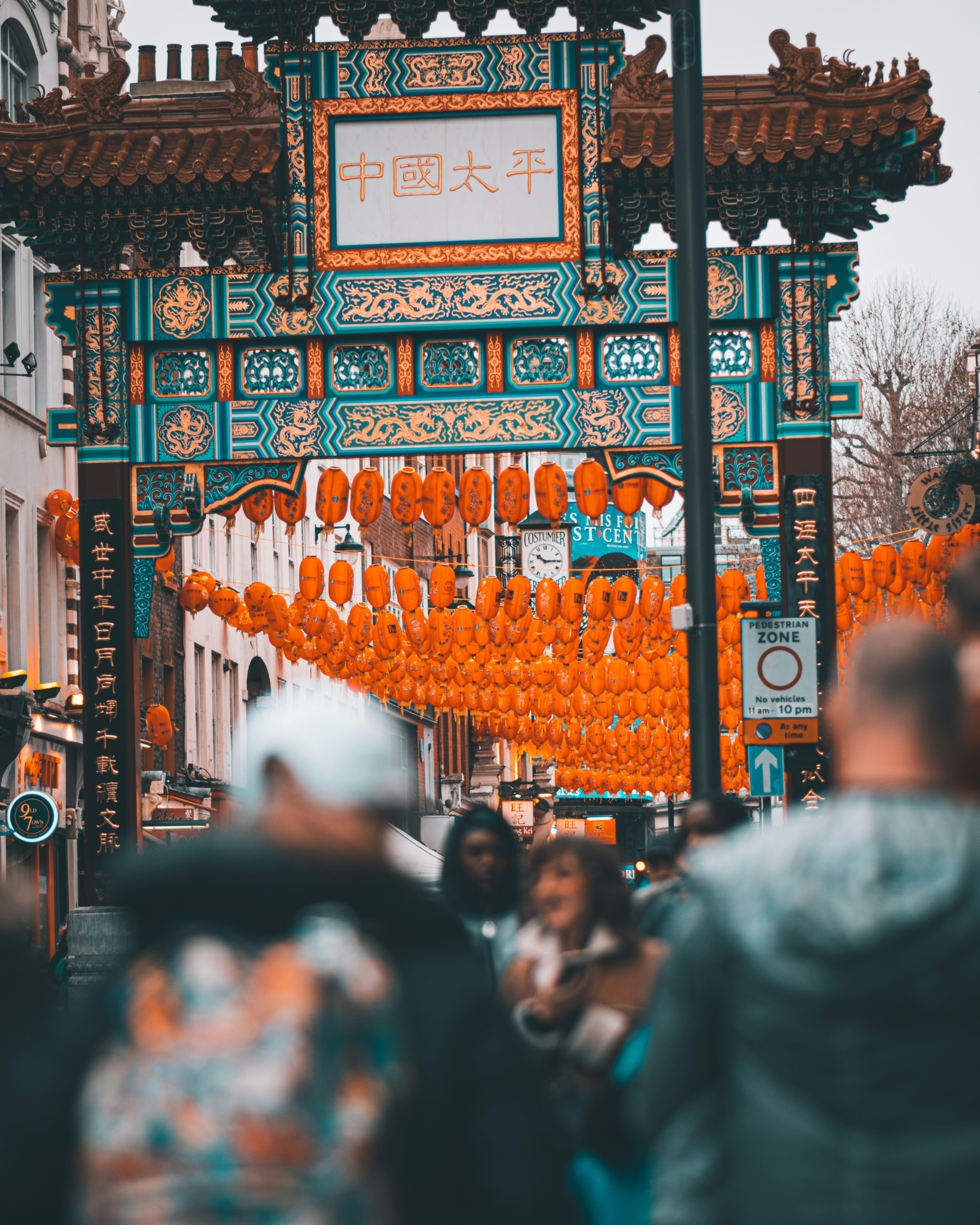 Lantern-lit Archway Over a Crowded Chinatown Street