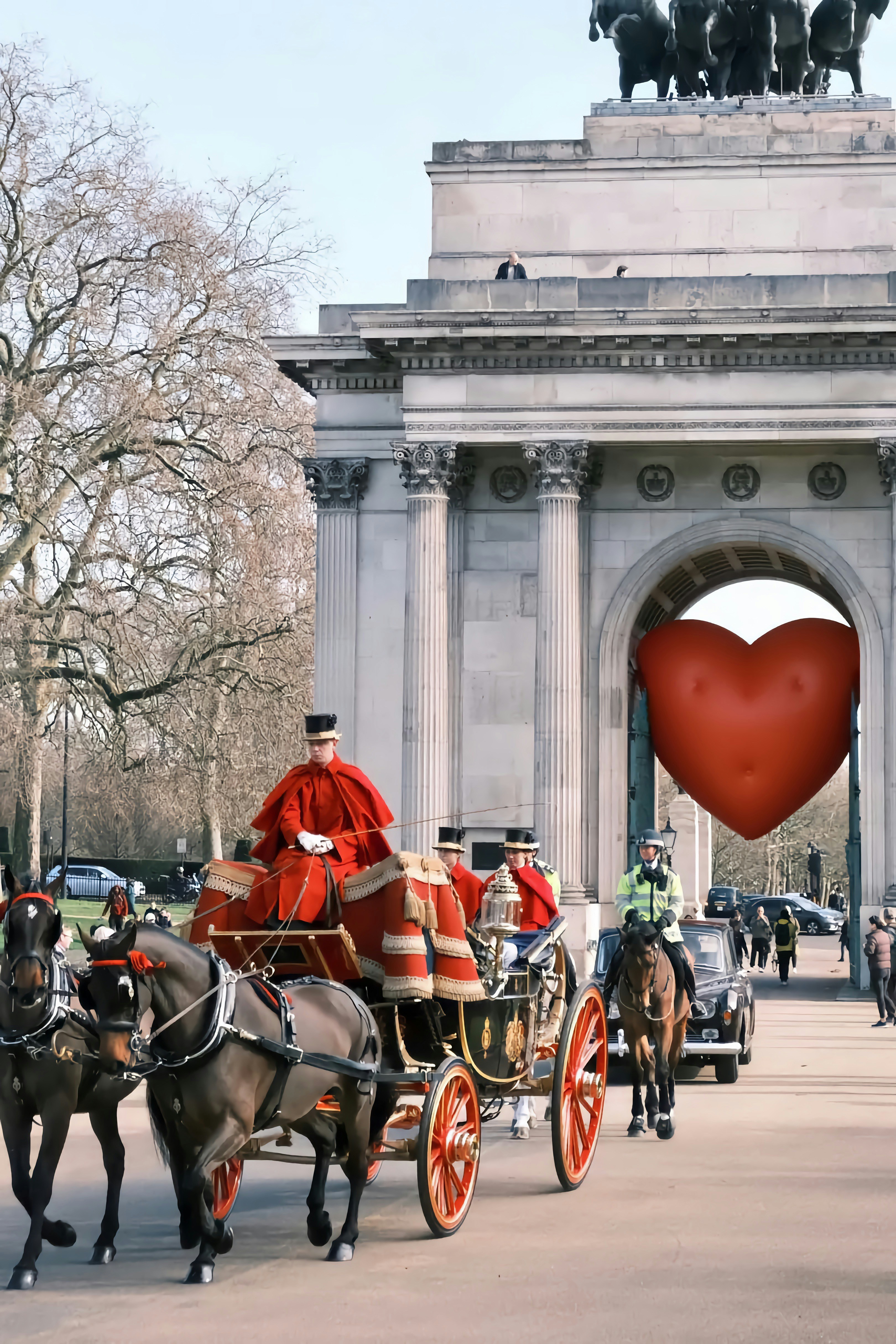 A couple of horses pulling a carriage down a street photo – Free Human ...