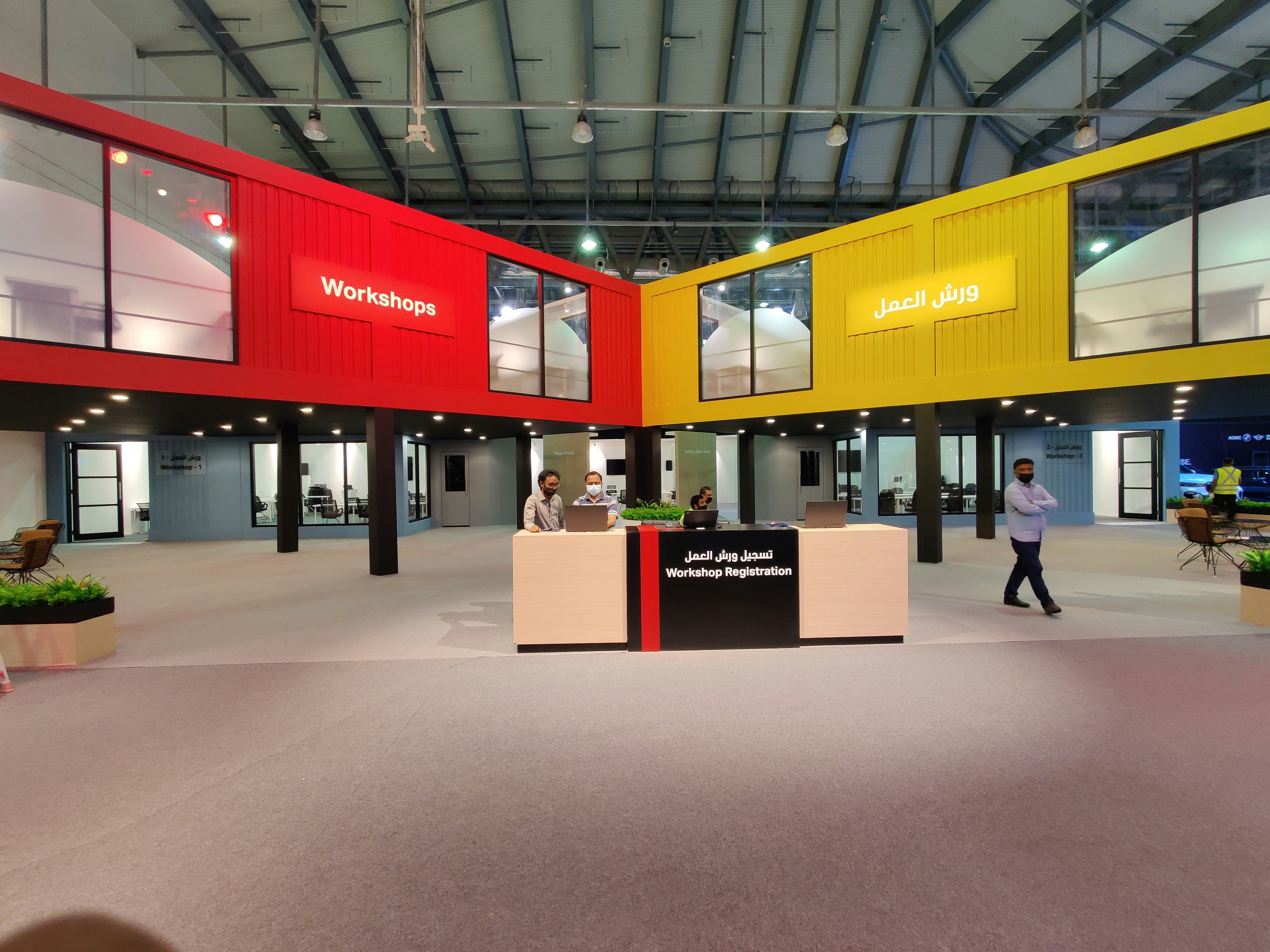 A man walking through a large open building photo – Free Human Image on ...