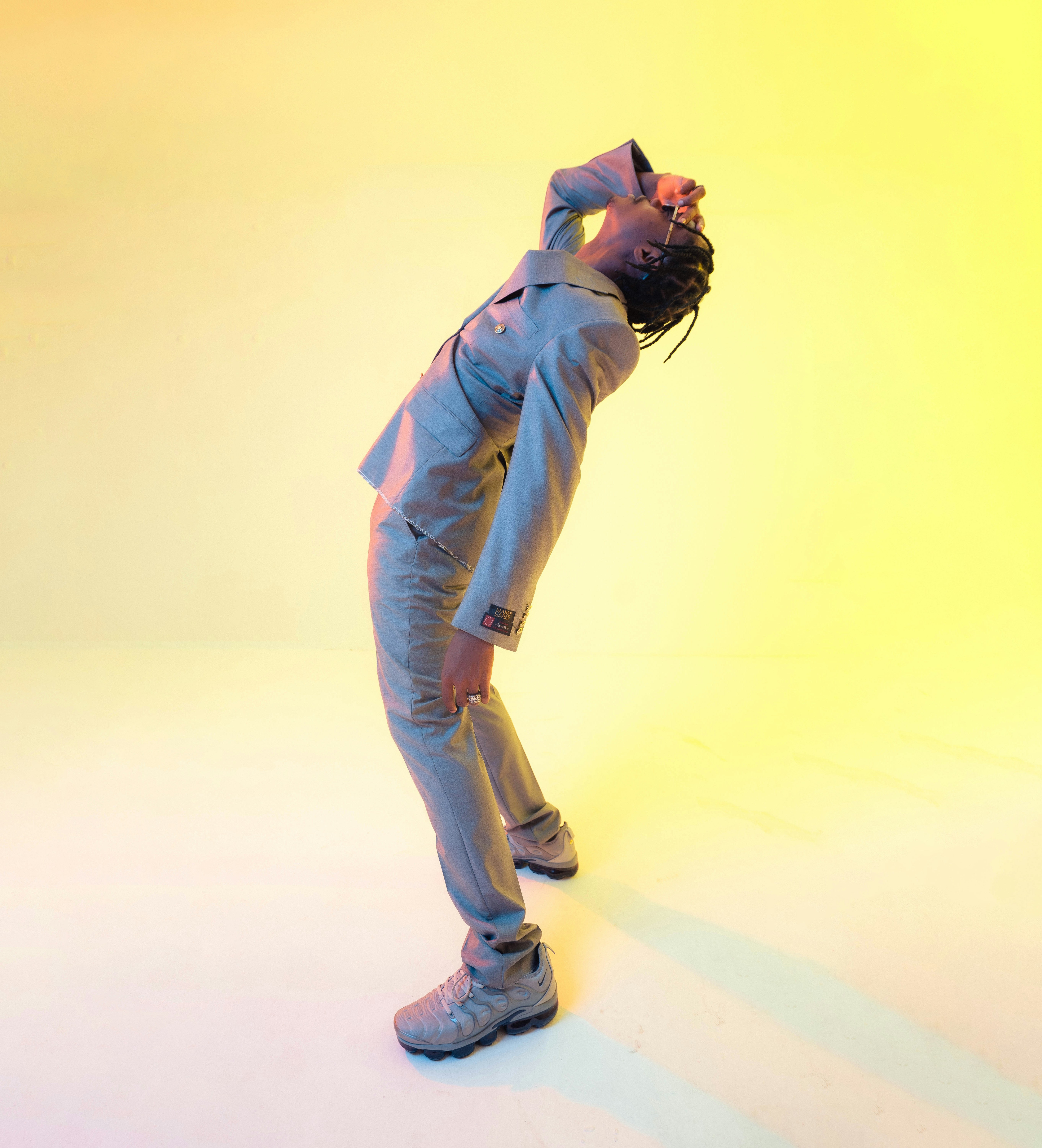 Dramatic Lean: A Neon-Bathed silhouette in Motion