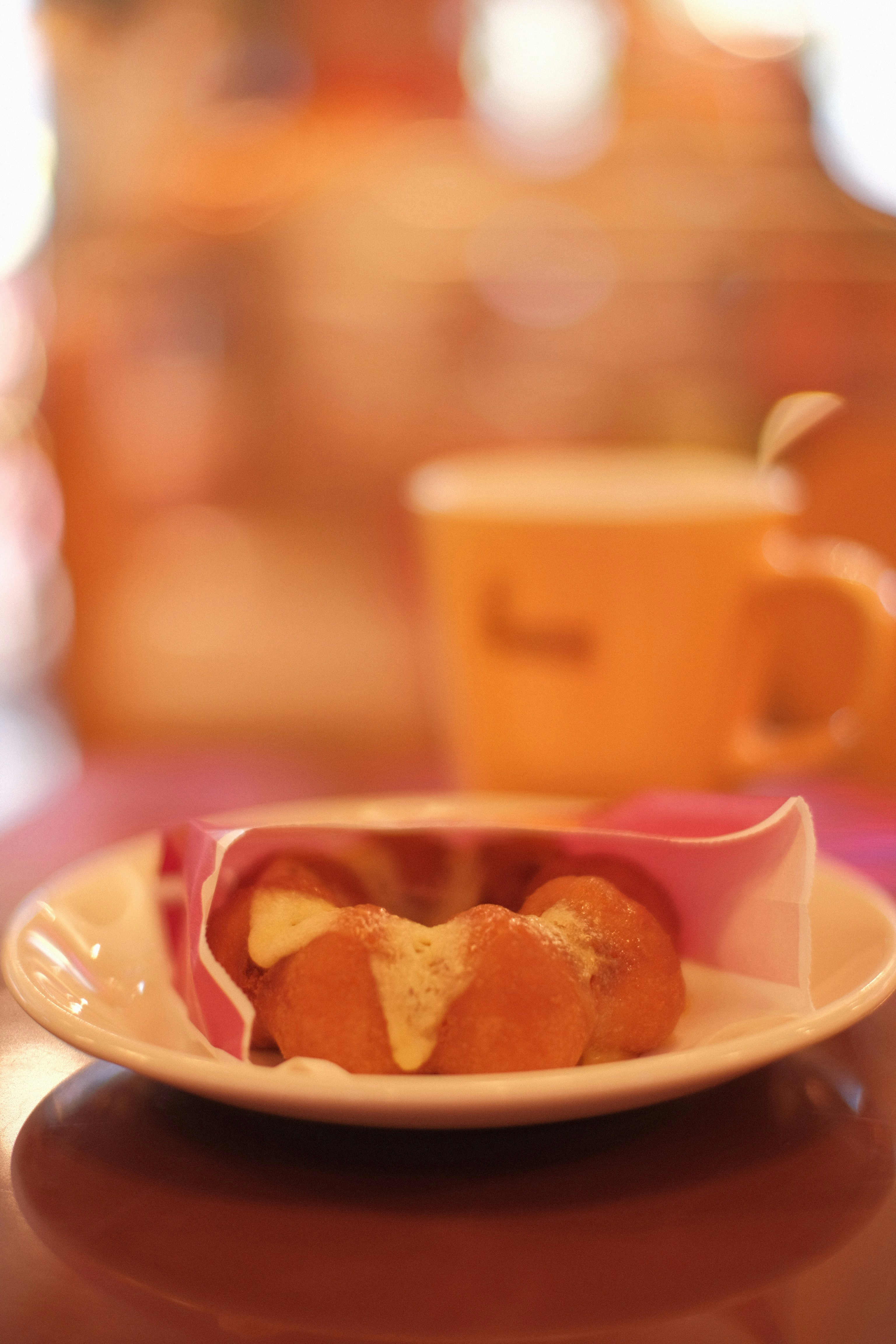 a white plate topped with two heart shaped pastries