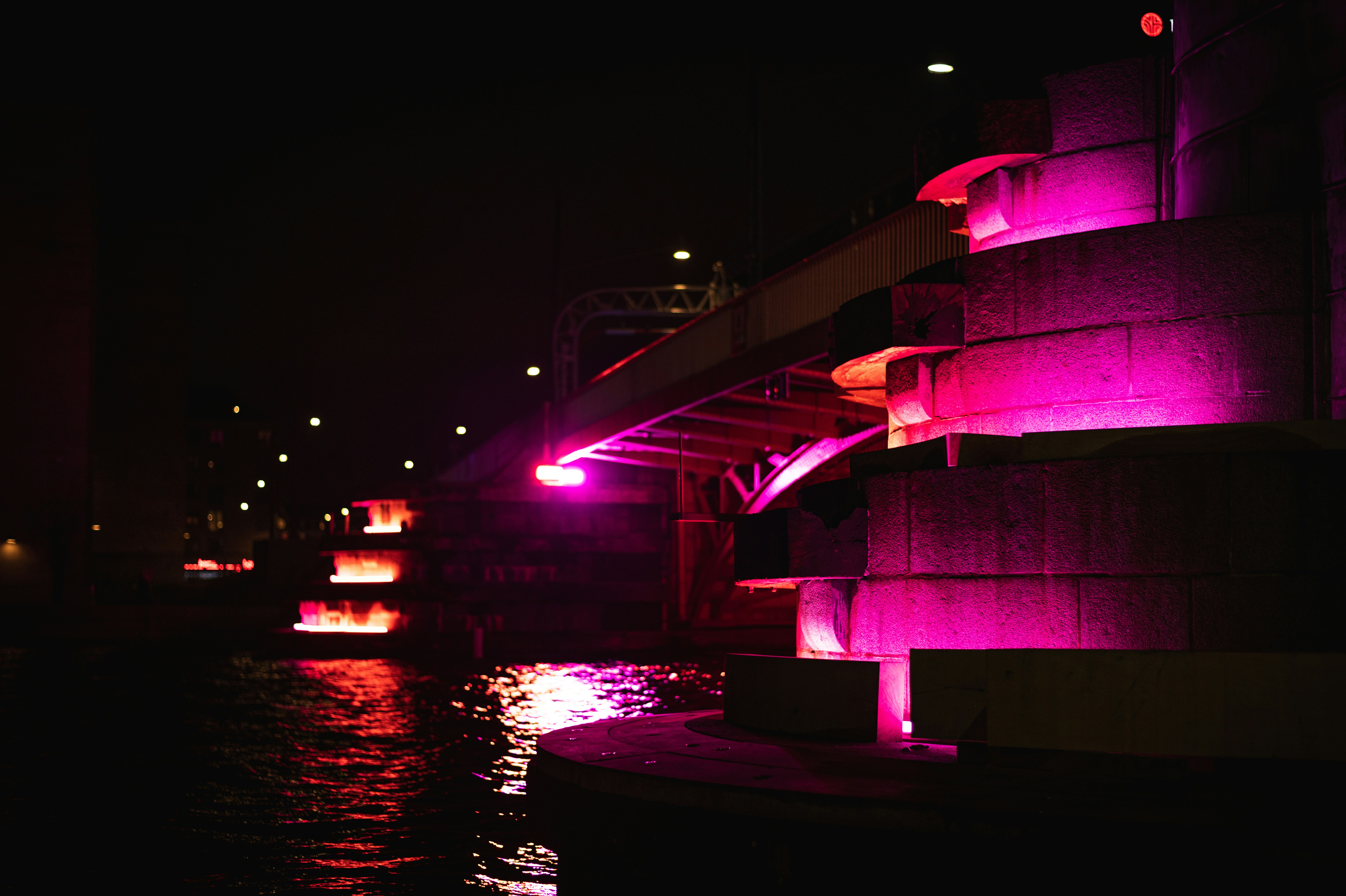Neon Cascades Along the Pier at Night