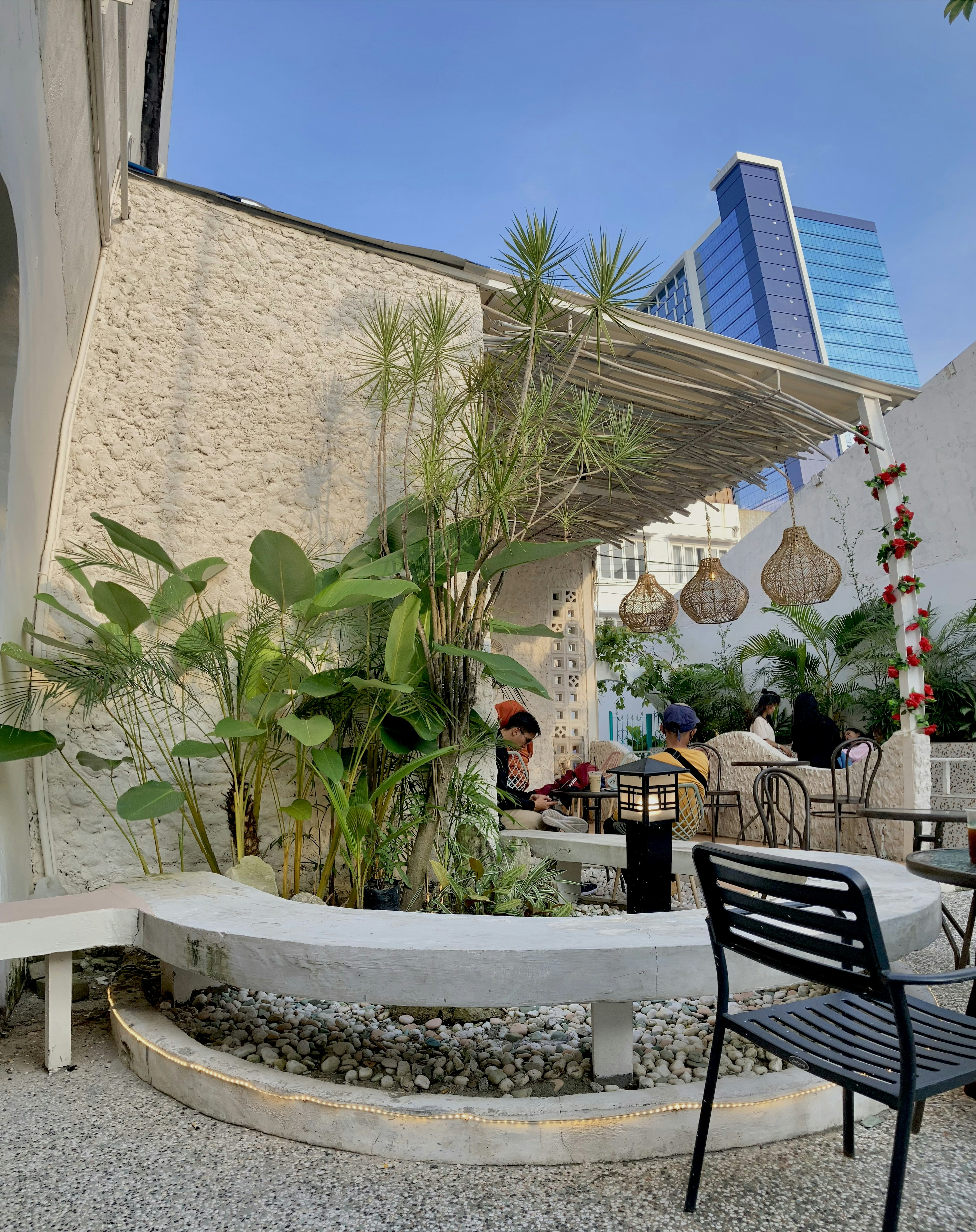 Courtyard Lounge Under a Canopy of Greenery