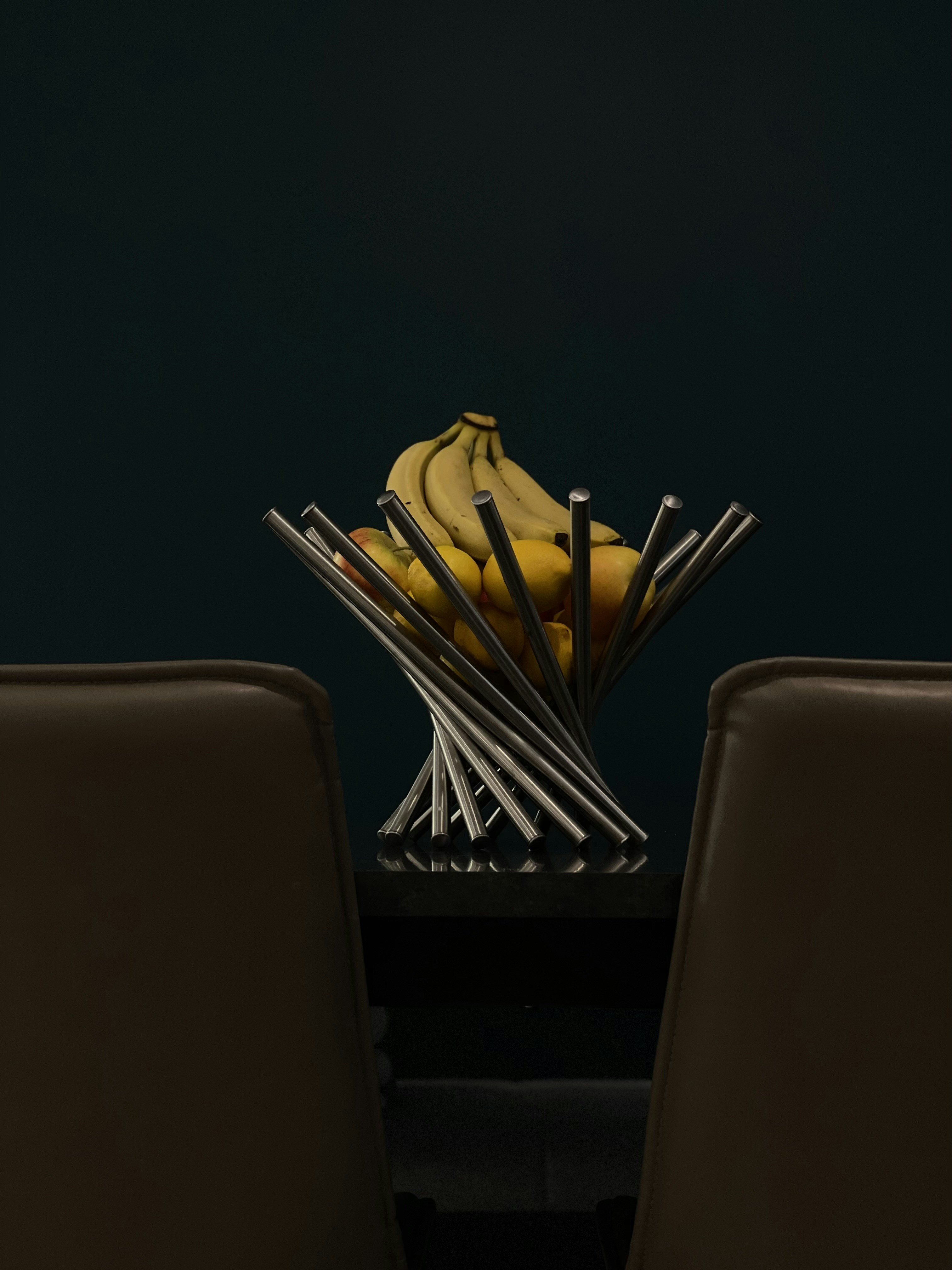 Banana Ballet in Chrome: a Dimly Lit Still-Life
