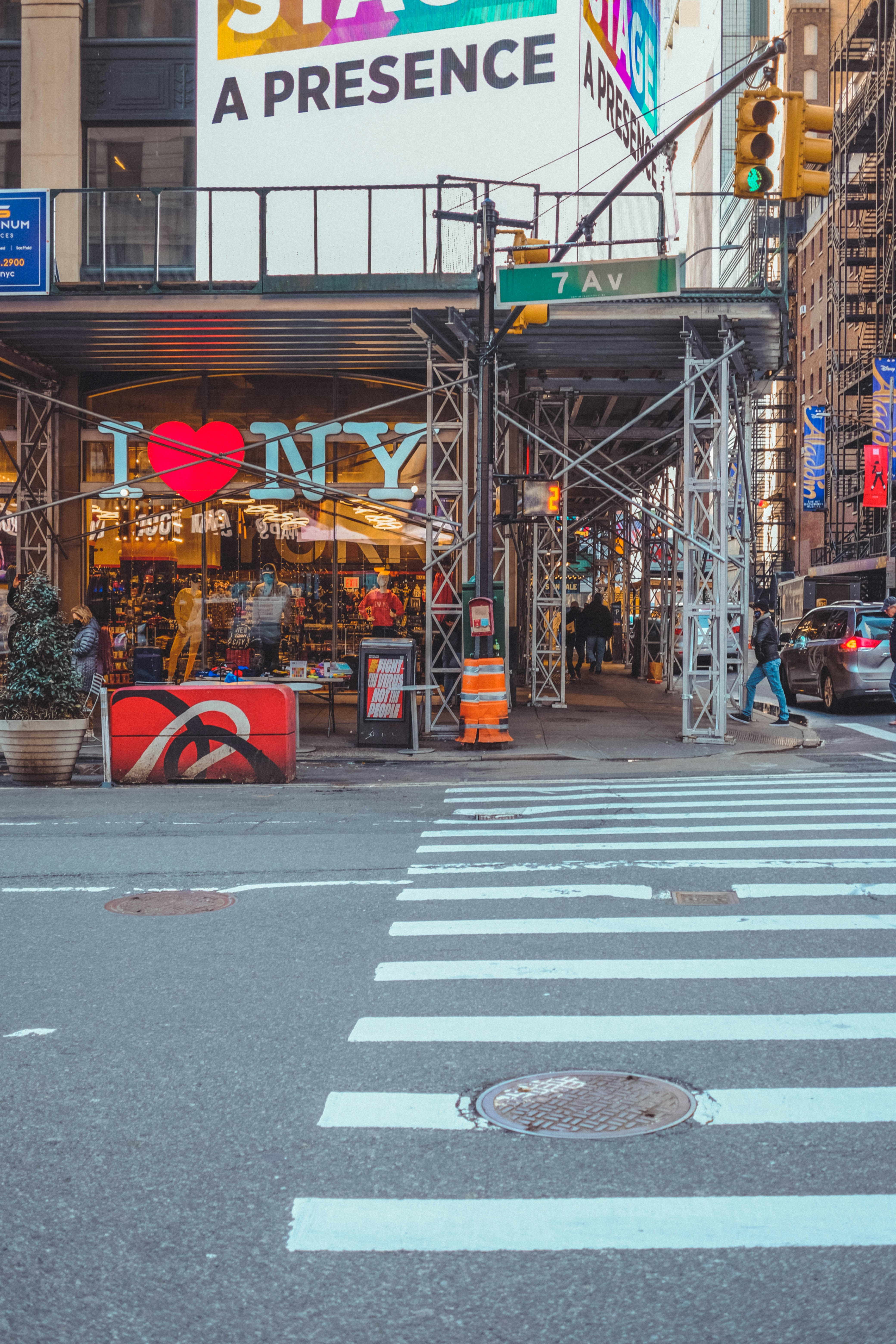 A city street with a traffic light and a street sign photo – Free ...