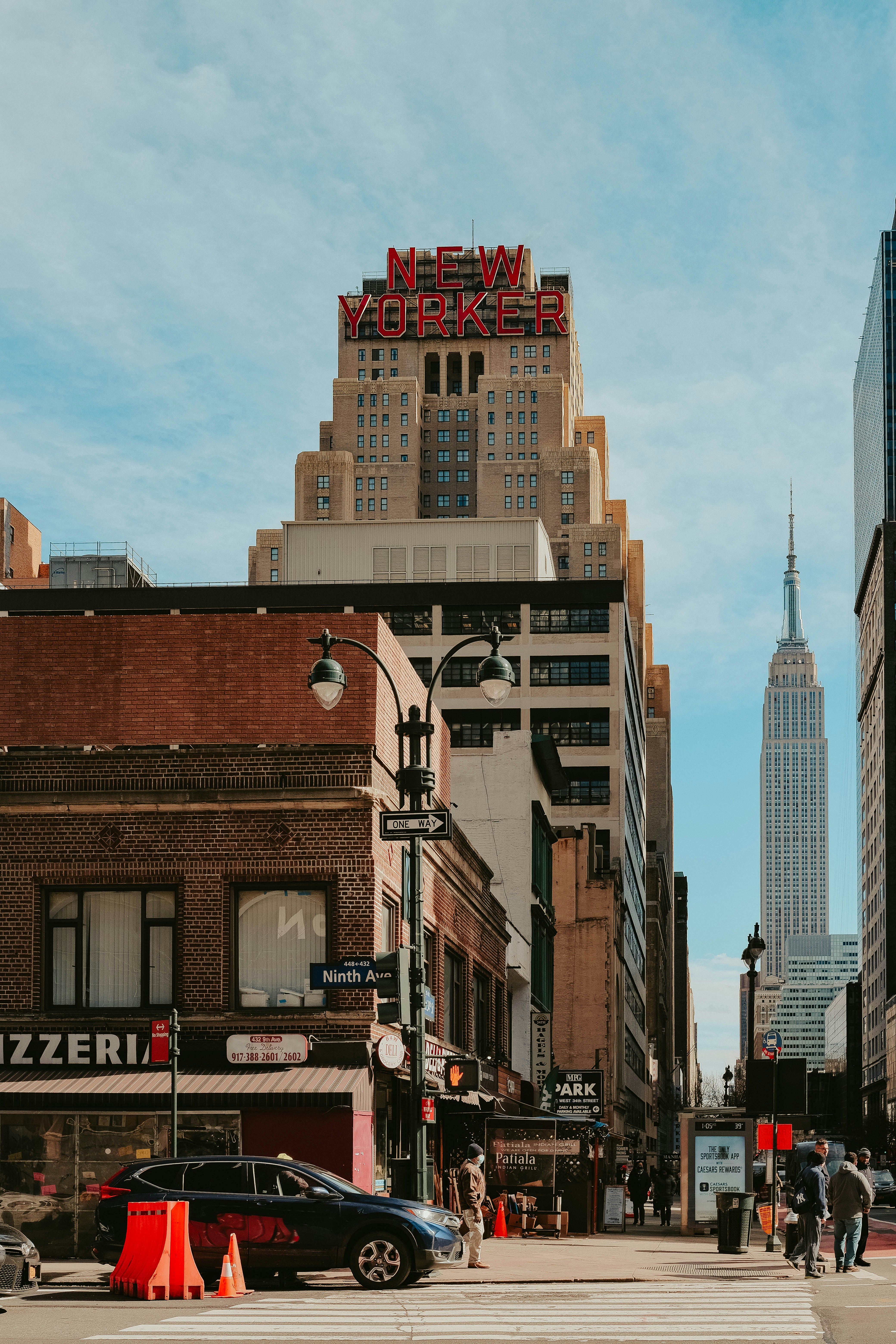 a busy city street with tall buildings in the background